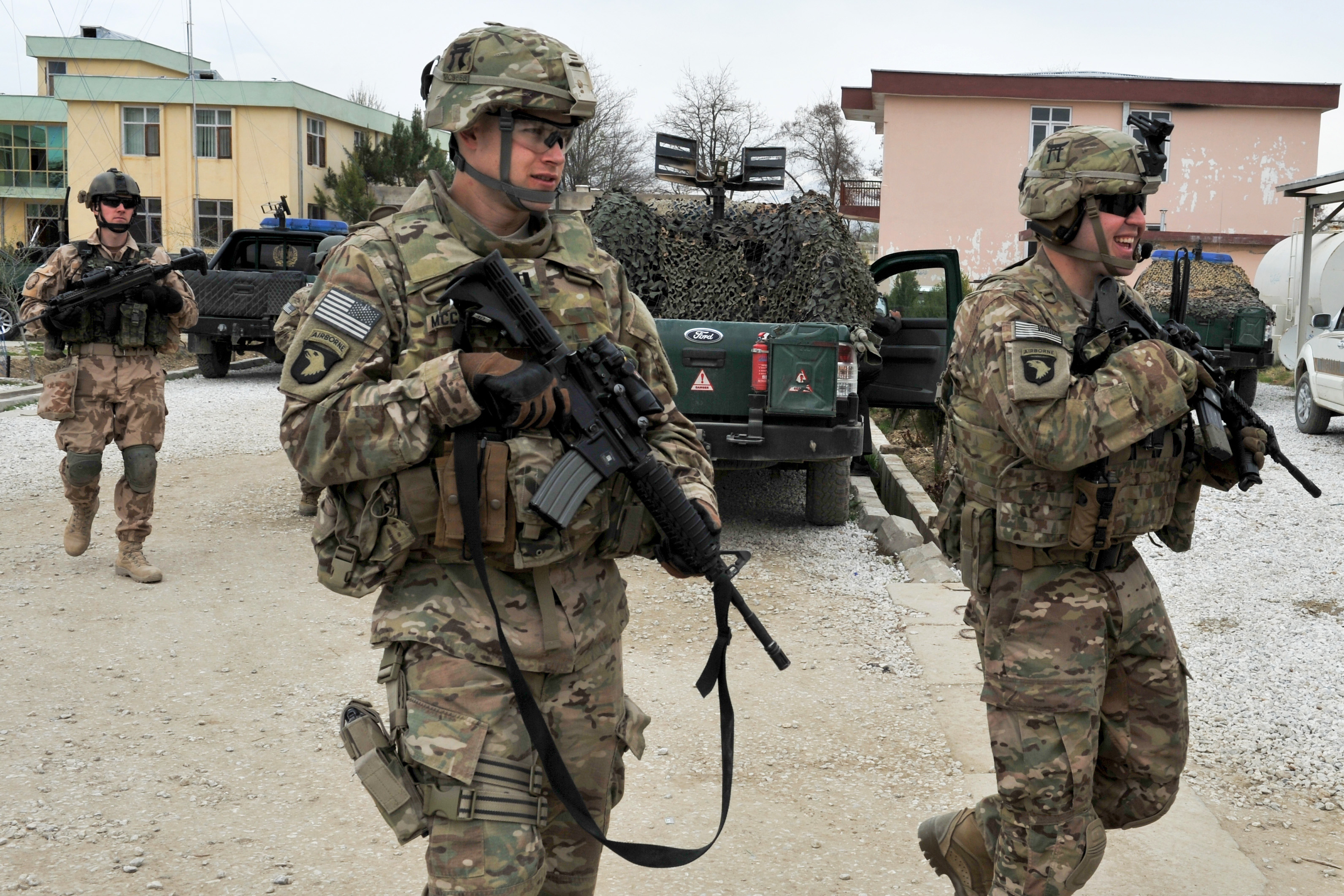 U.S. and Czech soldiers depart the Bagram district governor's building ...