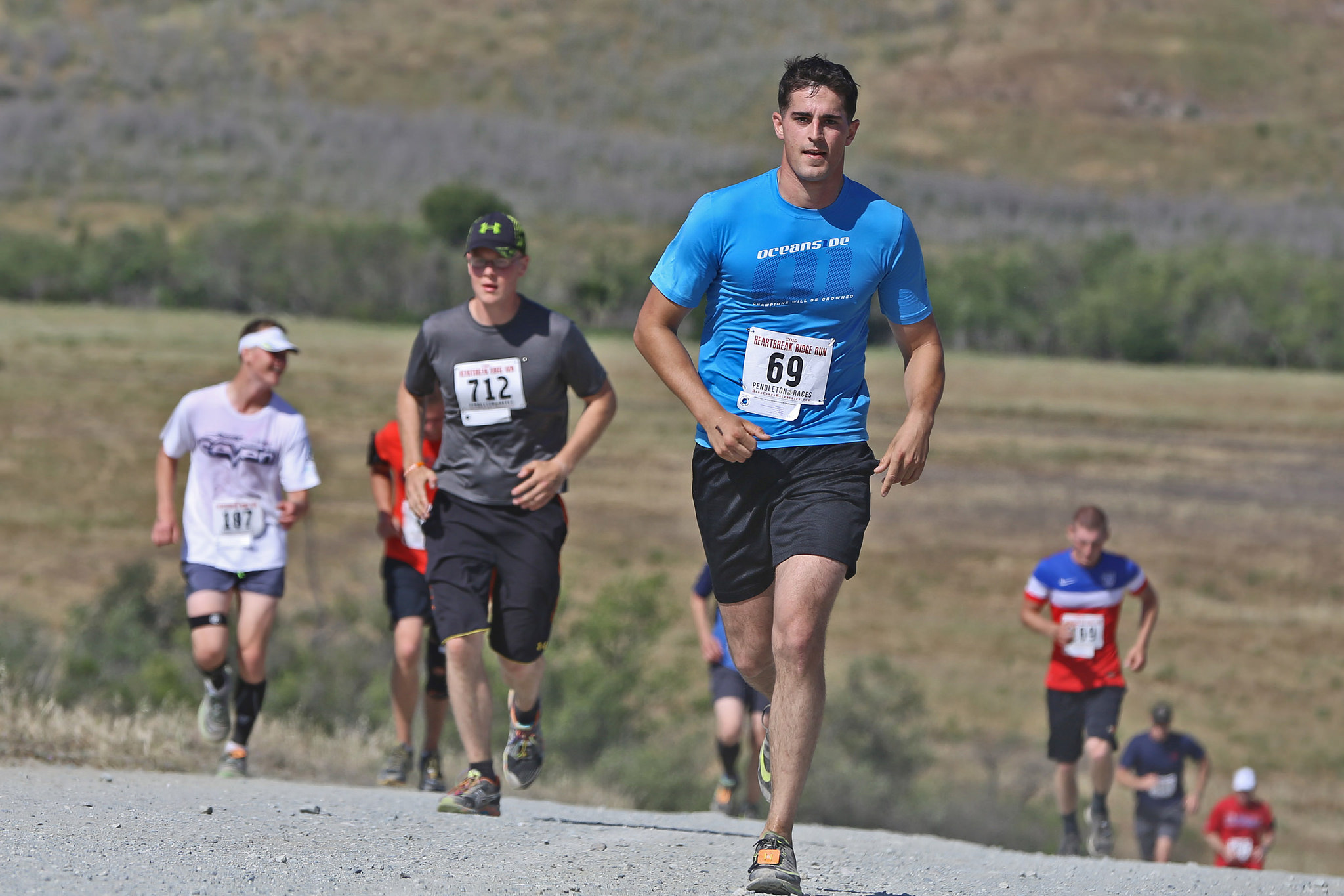 Runners race through rolling hills during 2015 Heartbreak Ridge Run