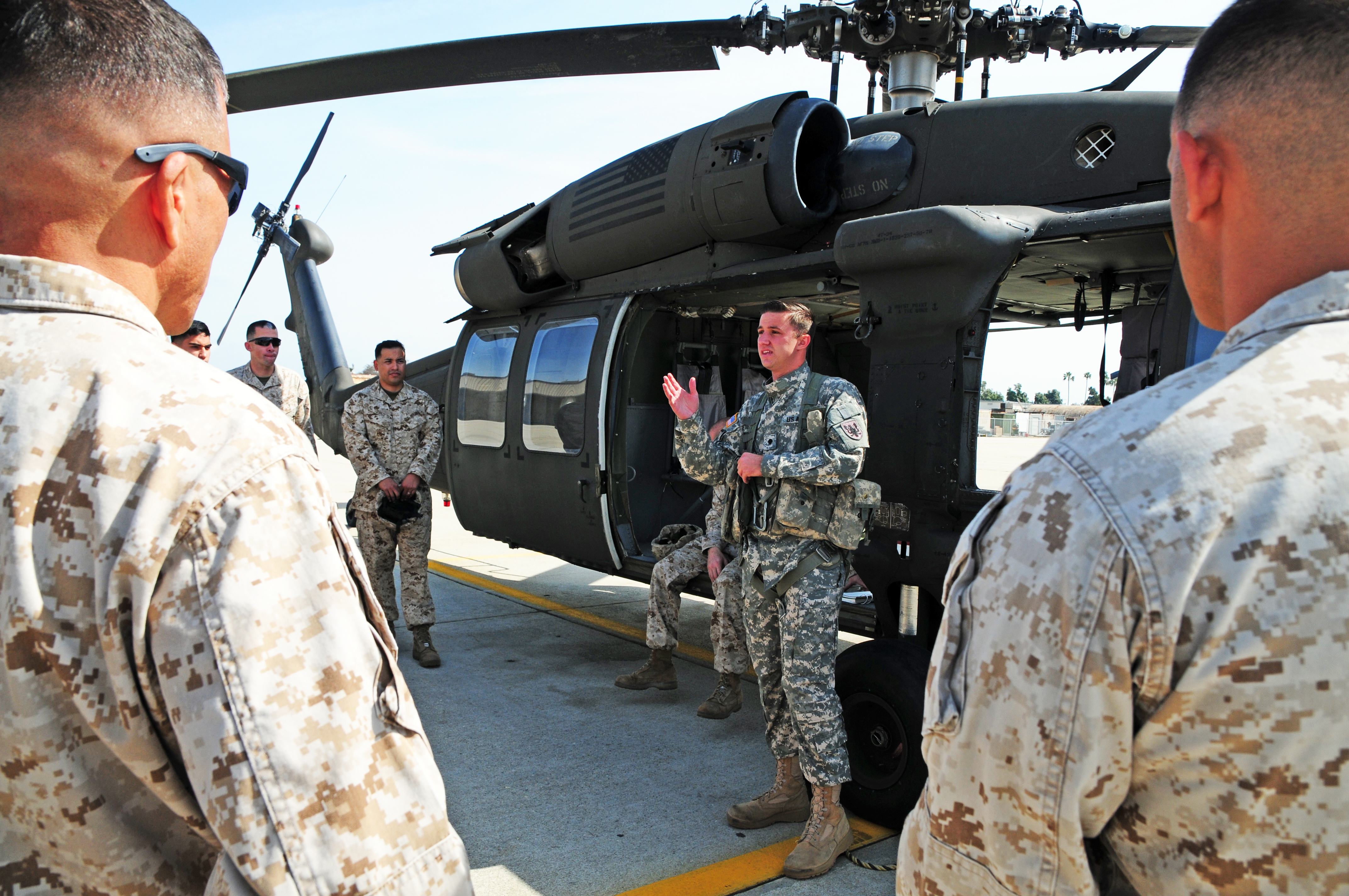 U.S. Army Reserve Spc. William Stepp, center, briefs U.S. Marines ...