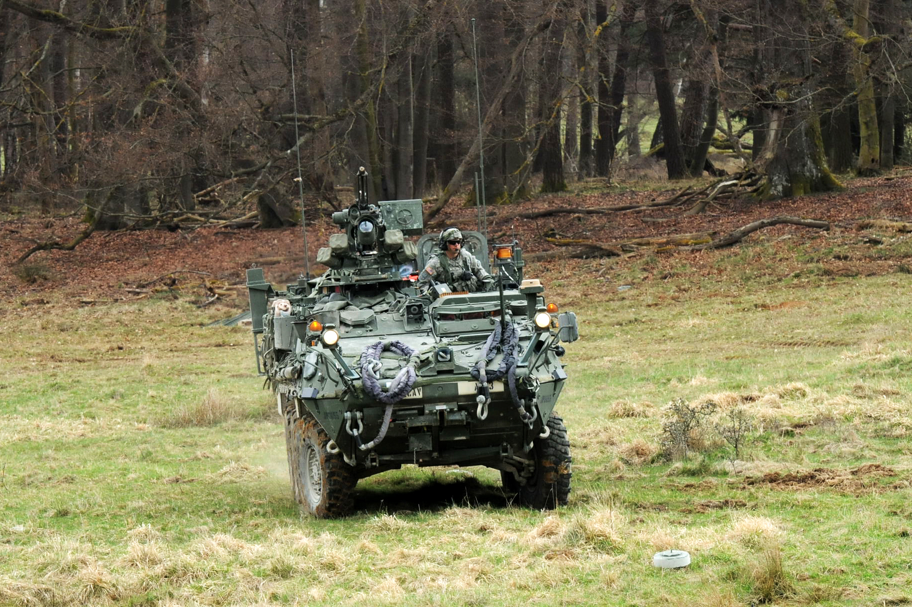 U.S. soldiers in a Stryker combat vehicle wait for a lane to be cleared ...