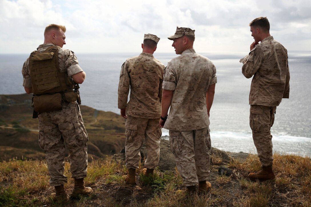 Marines take a break after hiking up to the top of Ulupau Crater at ...