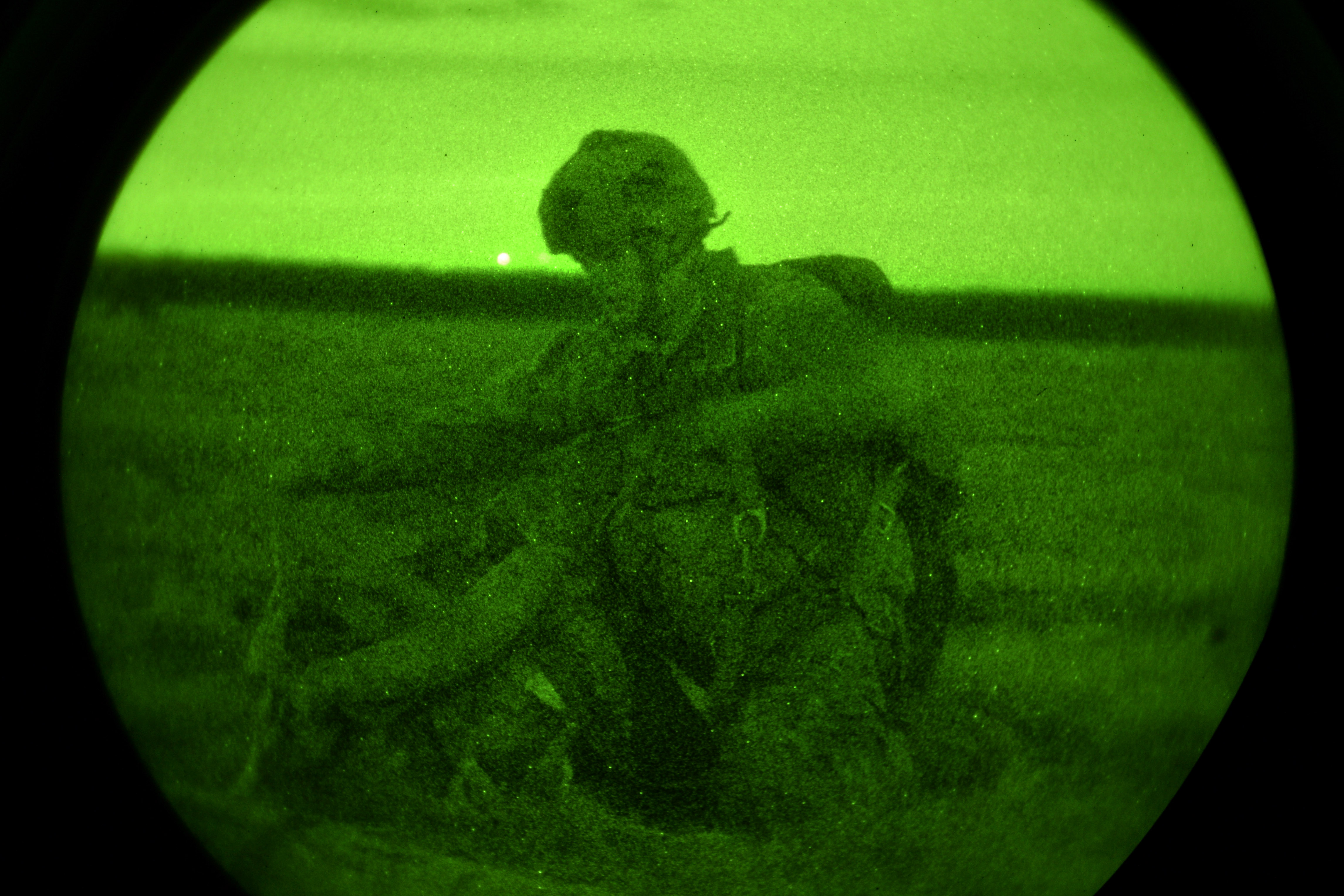 U.S. Army Staff Sgt. Jeremy Whitman packs his gear after a static line ...
