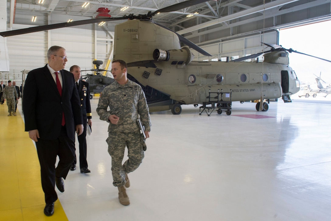 Deputy Defense Secretary Bob Work walks with Army Lt. Col. Michael ...