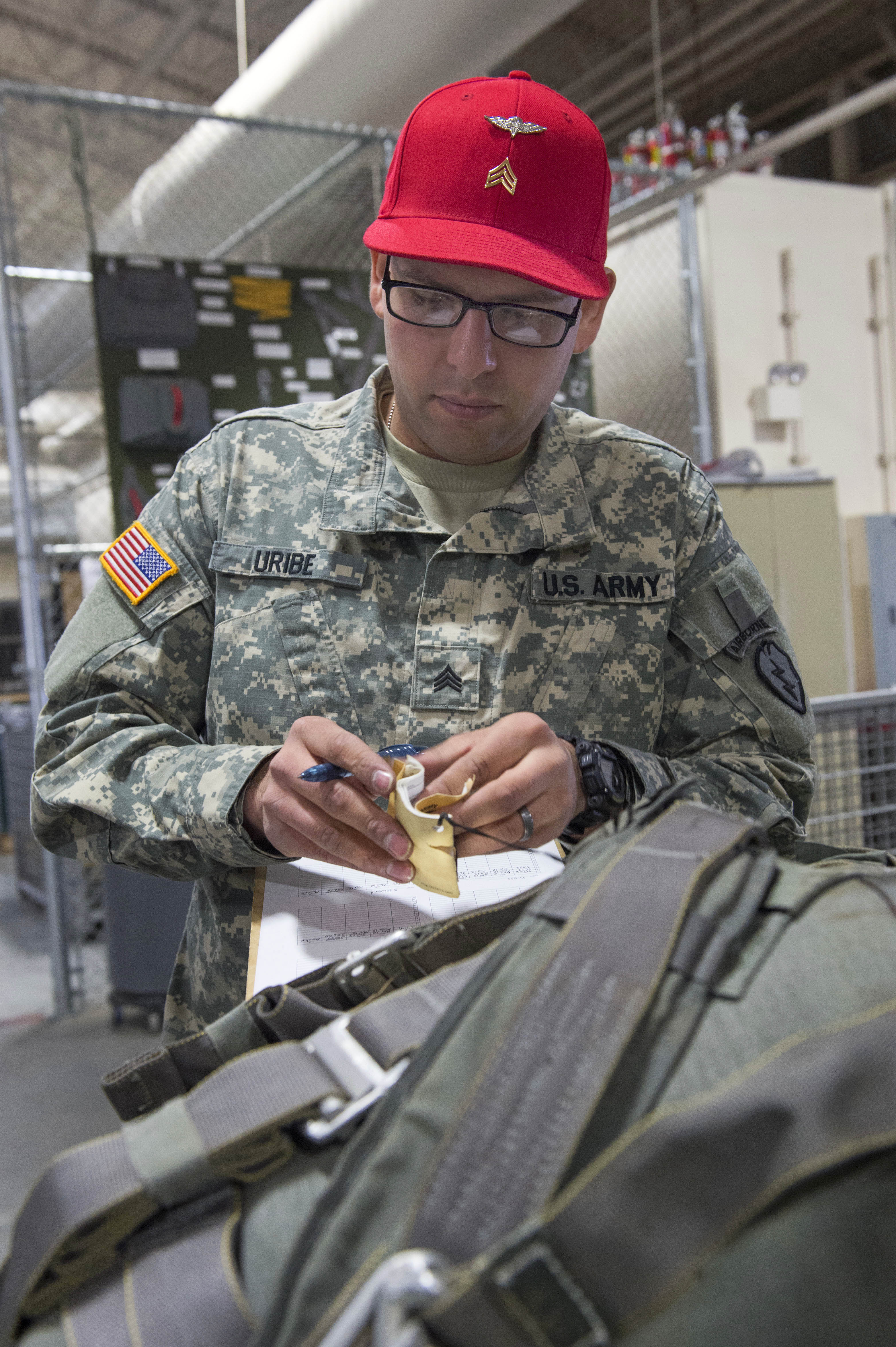 Army Sgt. Edgar Uriberobles inspects and logs a T-11 advanced tactical ...