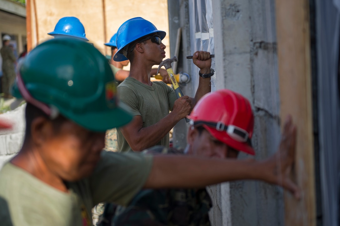 Service members build elementary school during Balikatan
