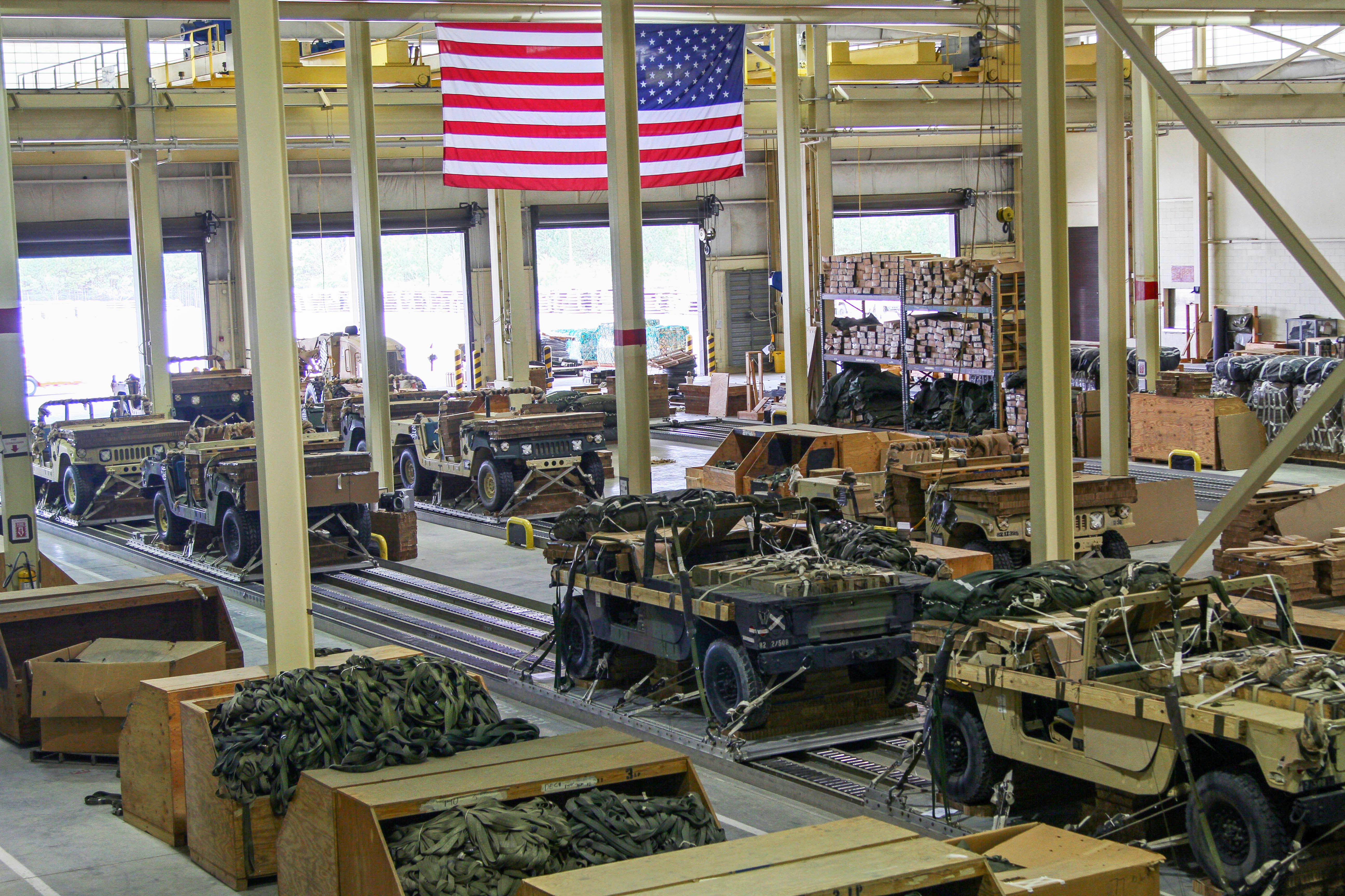 Vehicles and equipment await delivery at the heavy drop rigging ...
