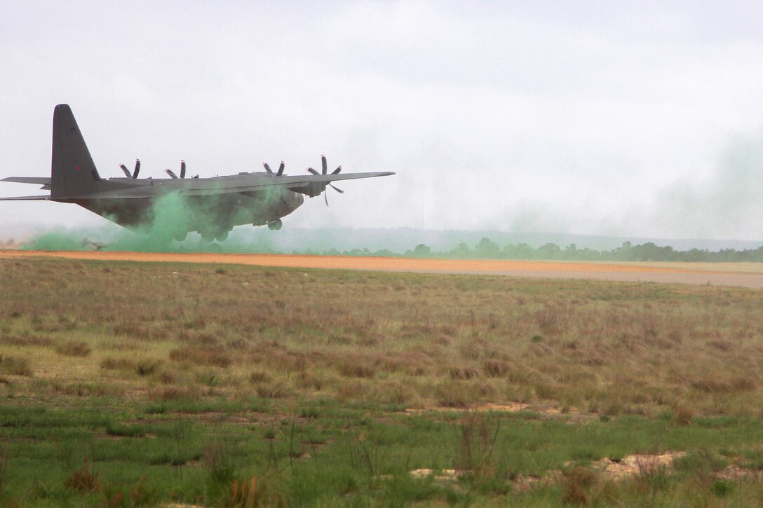 A British air force C-130 Hercules aircraft takes off from Fort Bragg ...