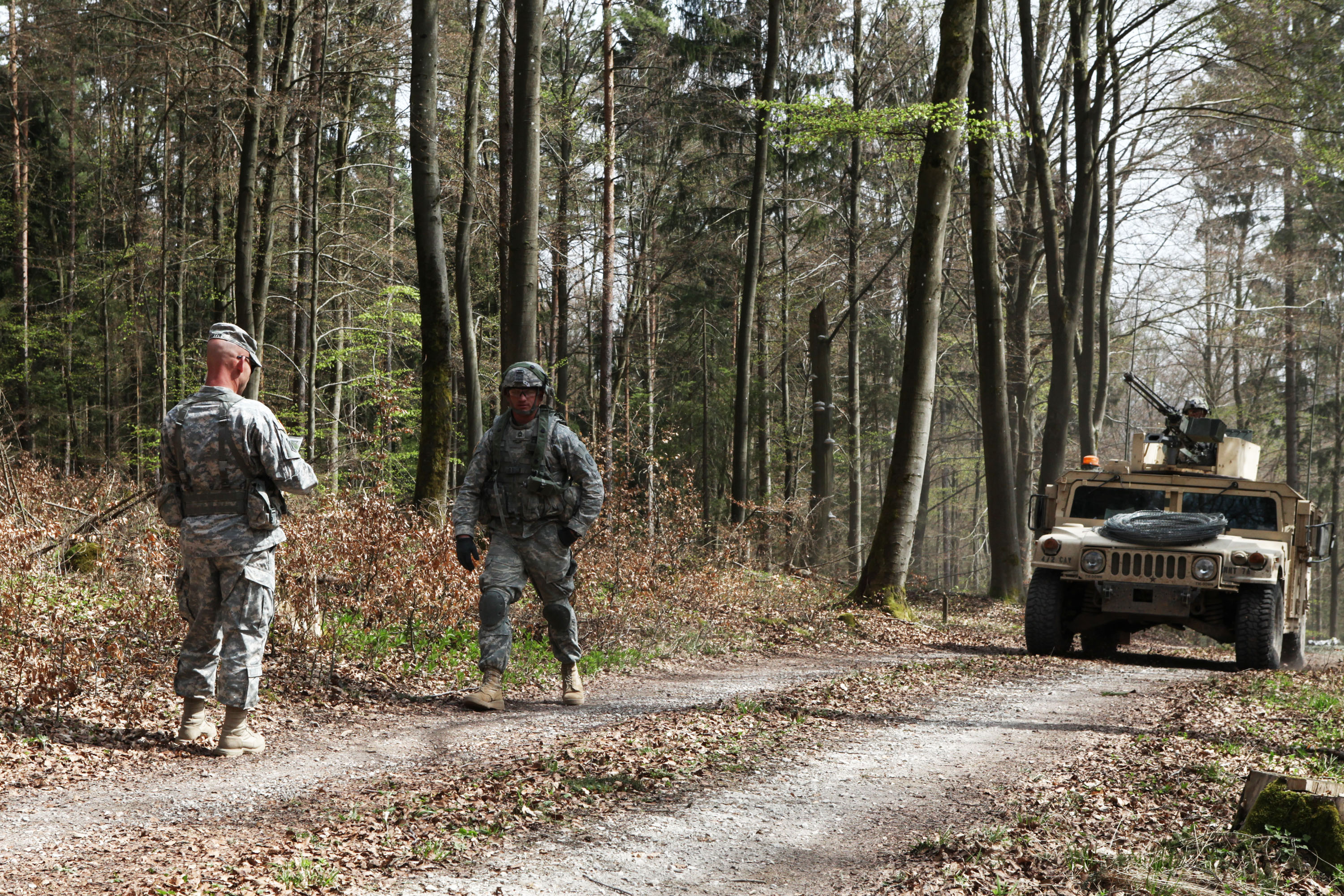U.S. Army Master Sgt. Noel Sawyer, left, instructs a U.S. soldier ...