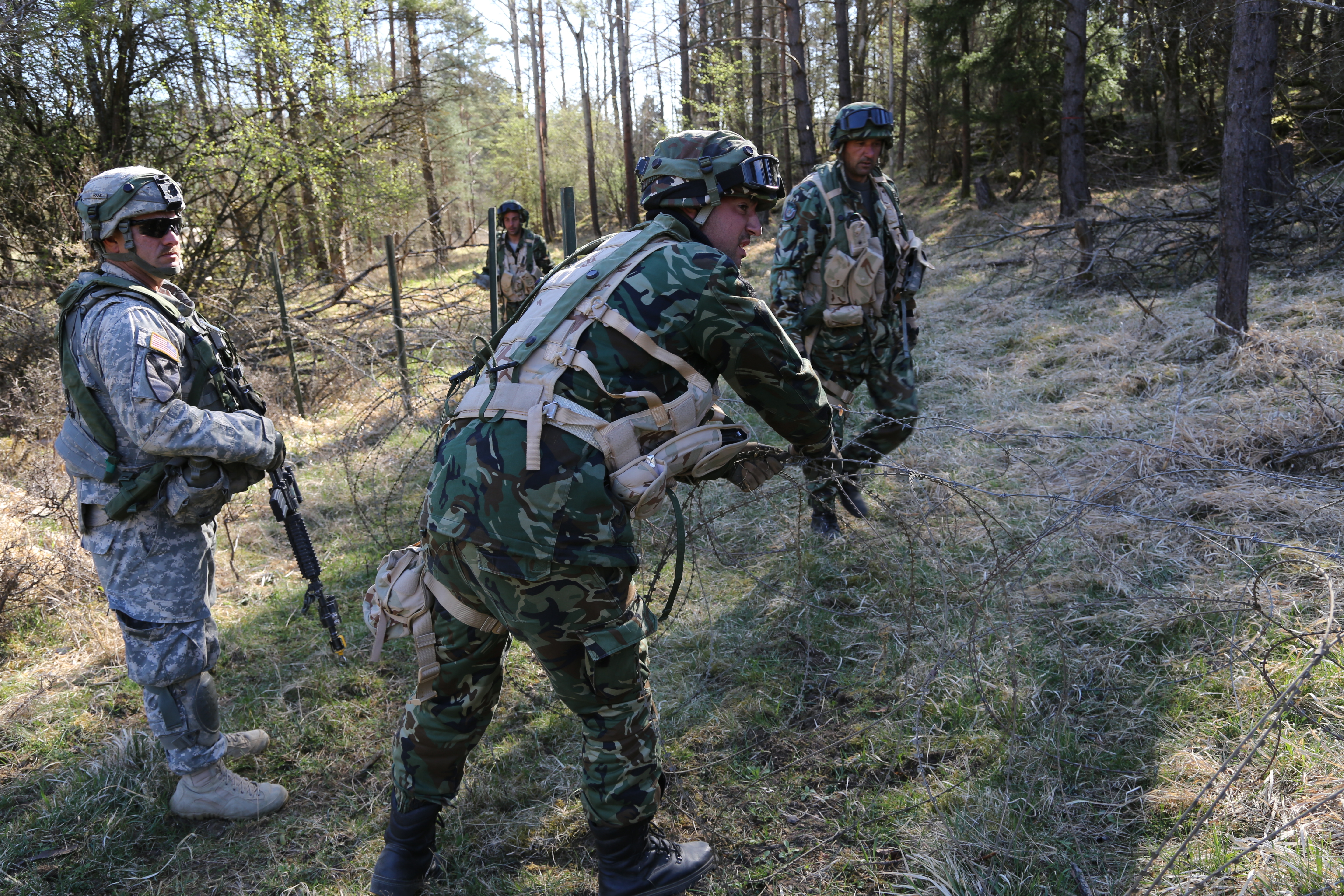 U.S. Army Staff Sgt. Thomas Raab, left, oversees the Bulgarian soldiers ...