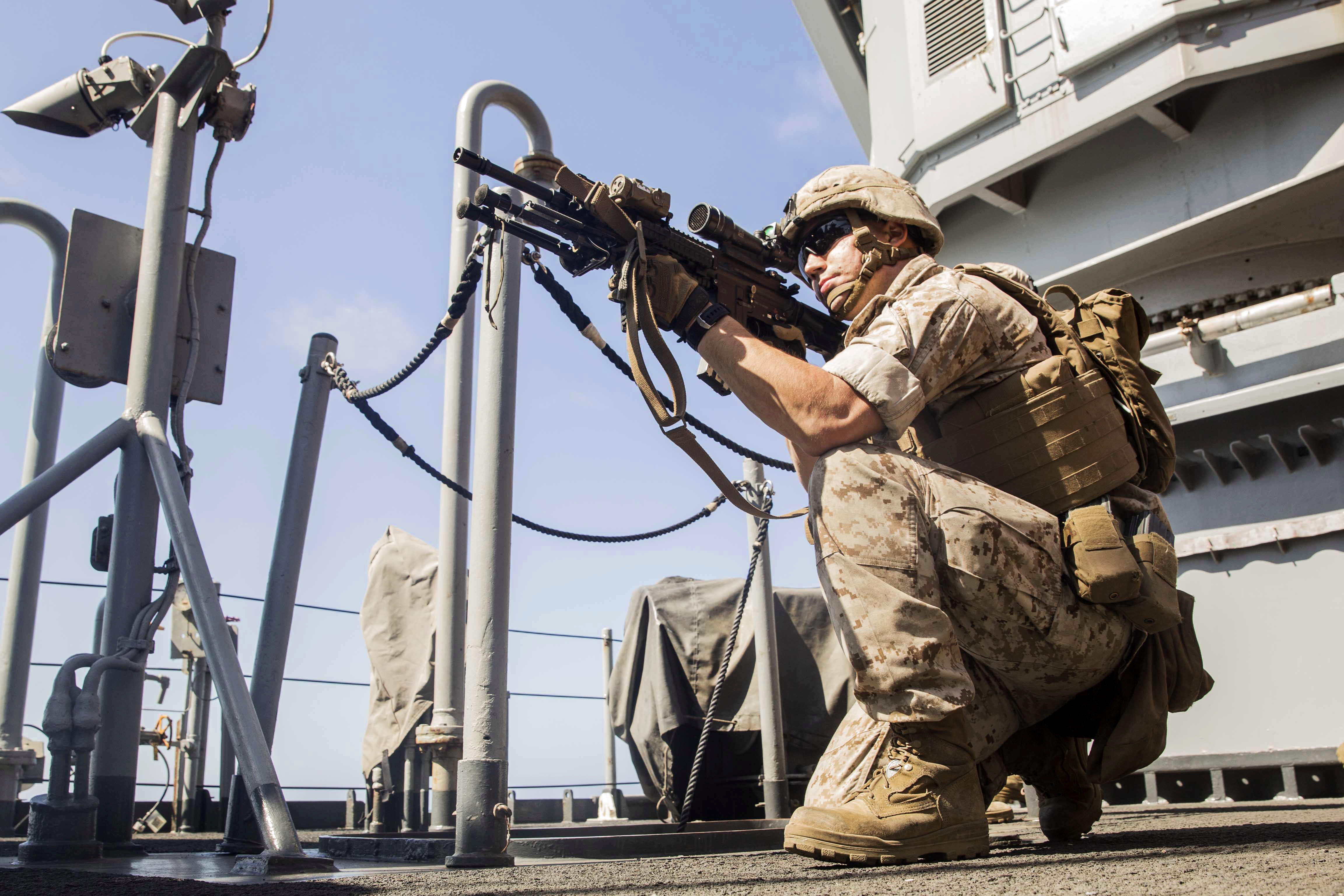 Marine Corps Lance Cpl. Trent Martin provides security while practicing ...