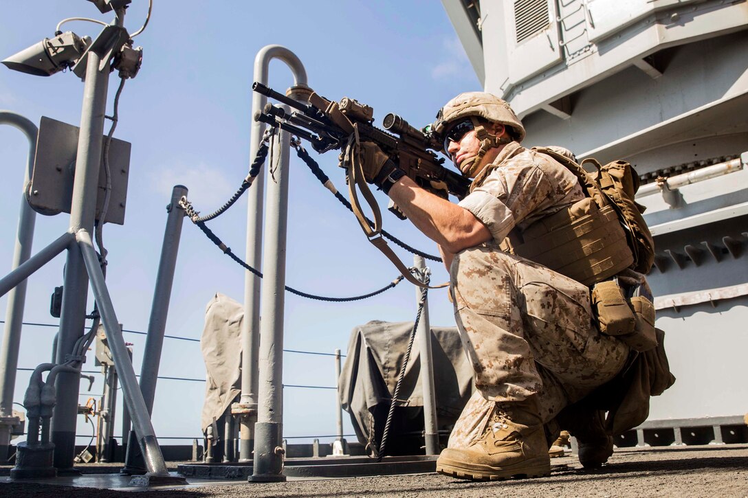 Marine Corps Lance Cpl. Trent Martin provides security while practicing ...