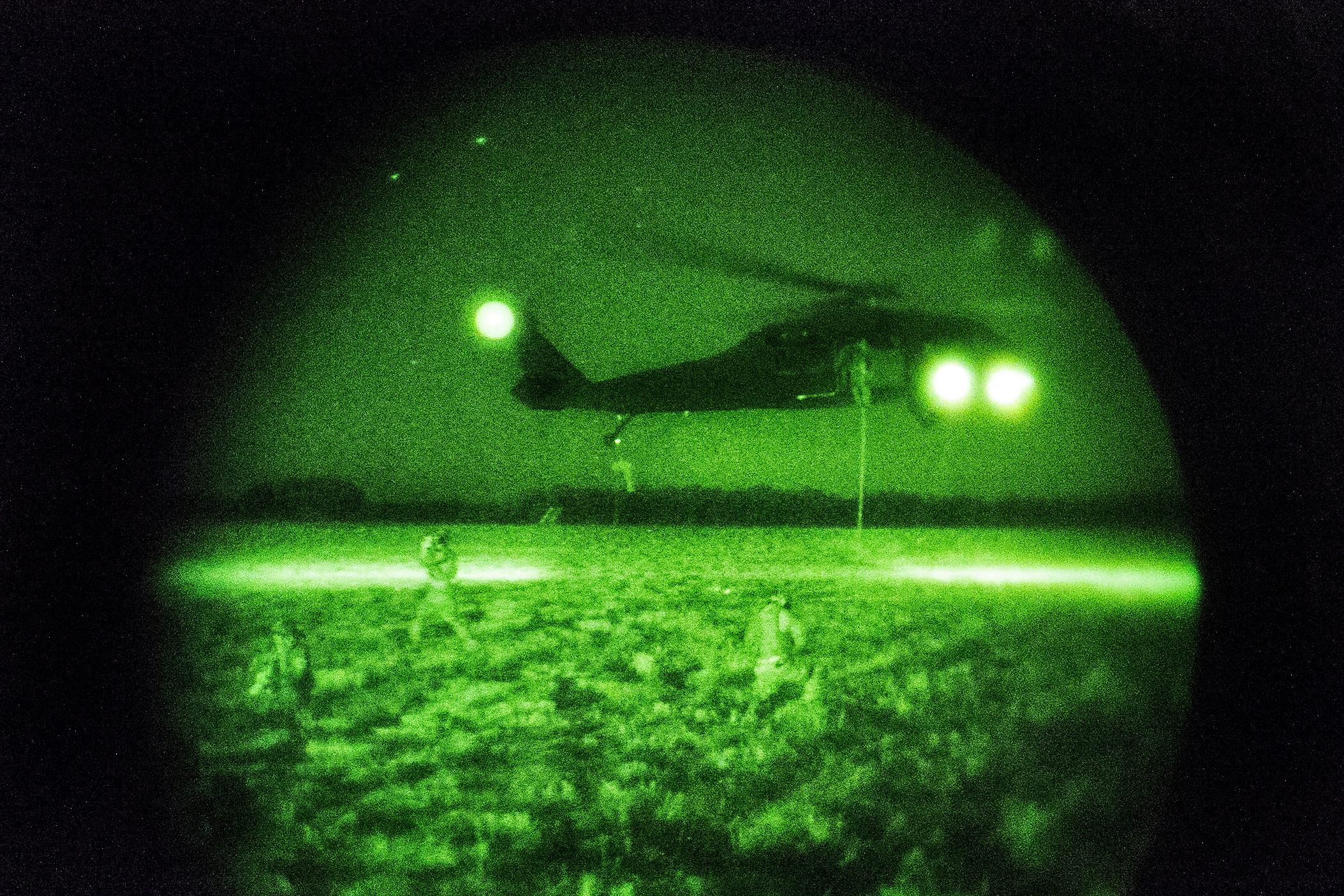 As seen through a night-vision device, airmen conduct the night ...