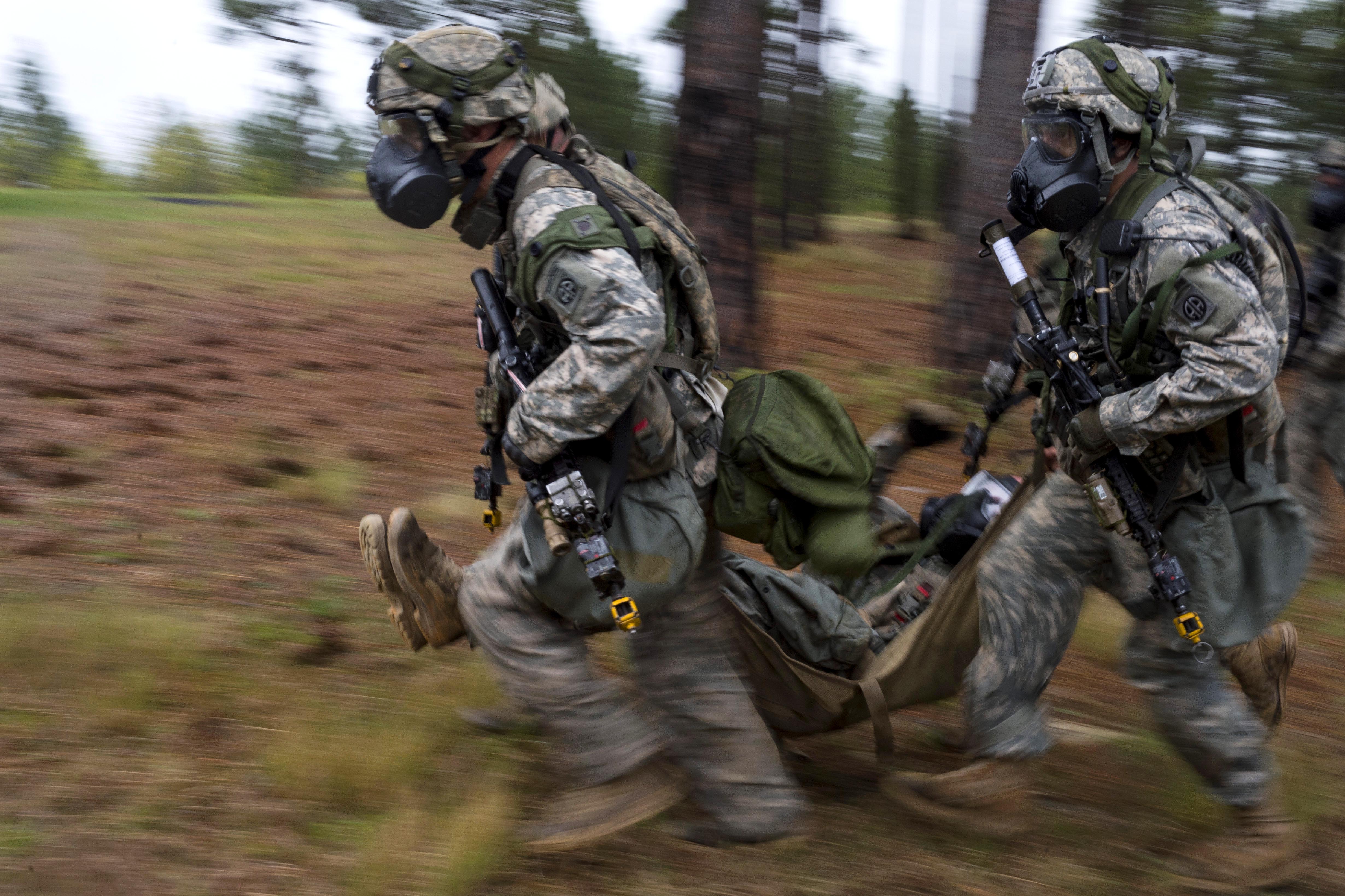 U.S. soldiers transport a simulated casualty during Combined Joint ...