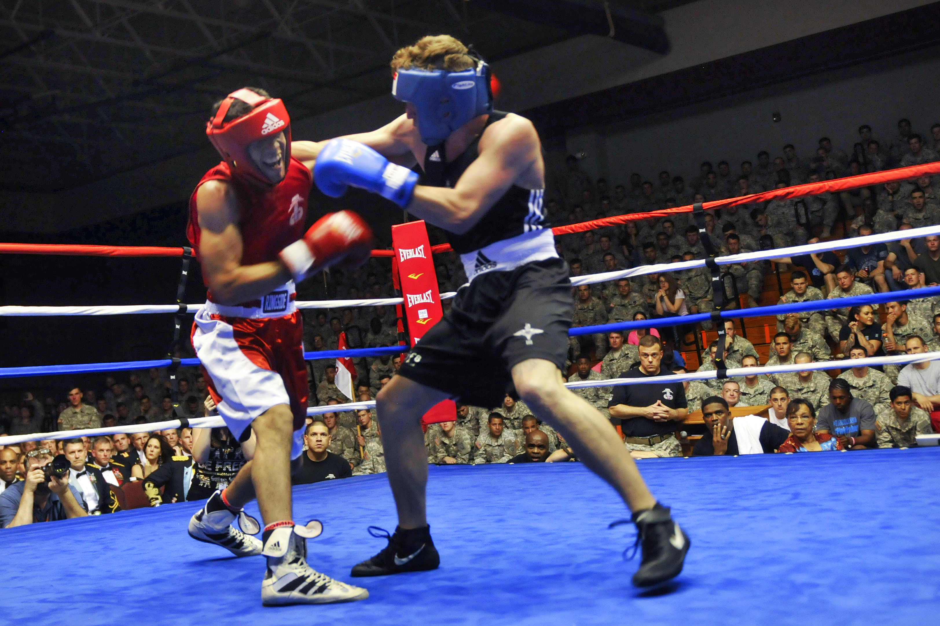 U.S. Army Spc. Sandy Rivas, left, connects with a punch to British Pvt ...