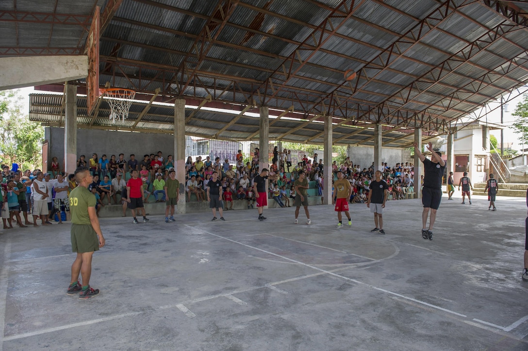 Panay CJCMOTF plays basketball in Taft Barangay during Balikatan
