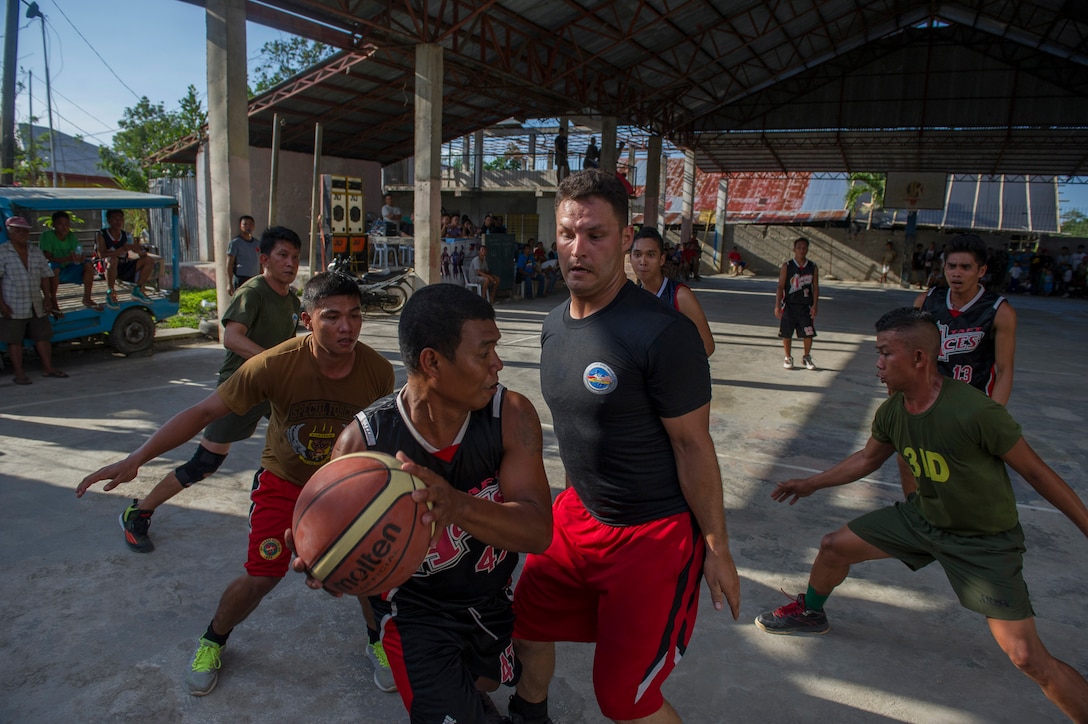 Panay CJCMOTF plays basketball in Taft Barangay during Balikatan