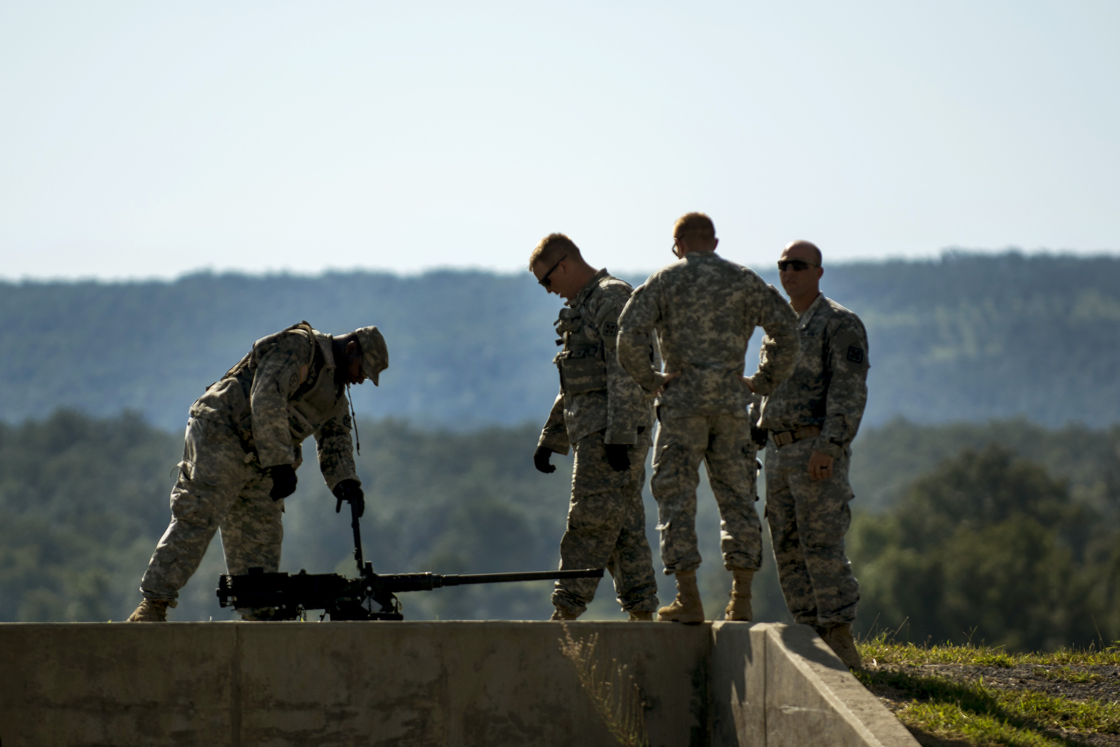 Army reserve soldiers break down an M2 Browning .50-caliber machine gun ...