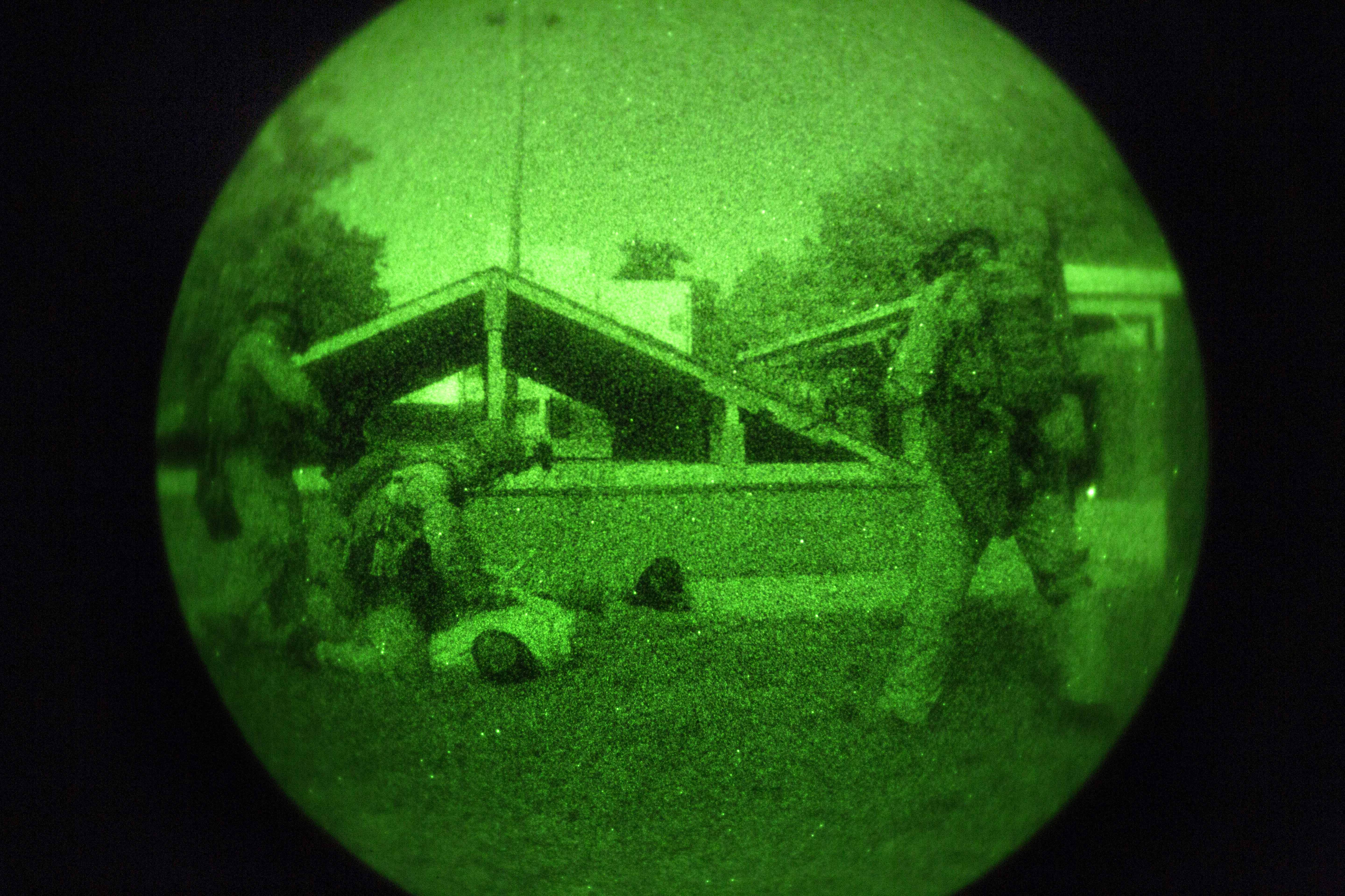 As seen through a night-vision device, Marines detain role players ...