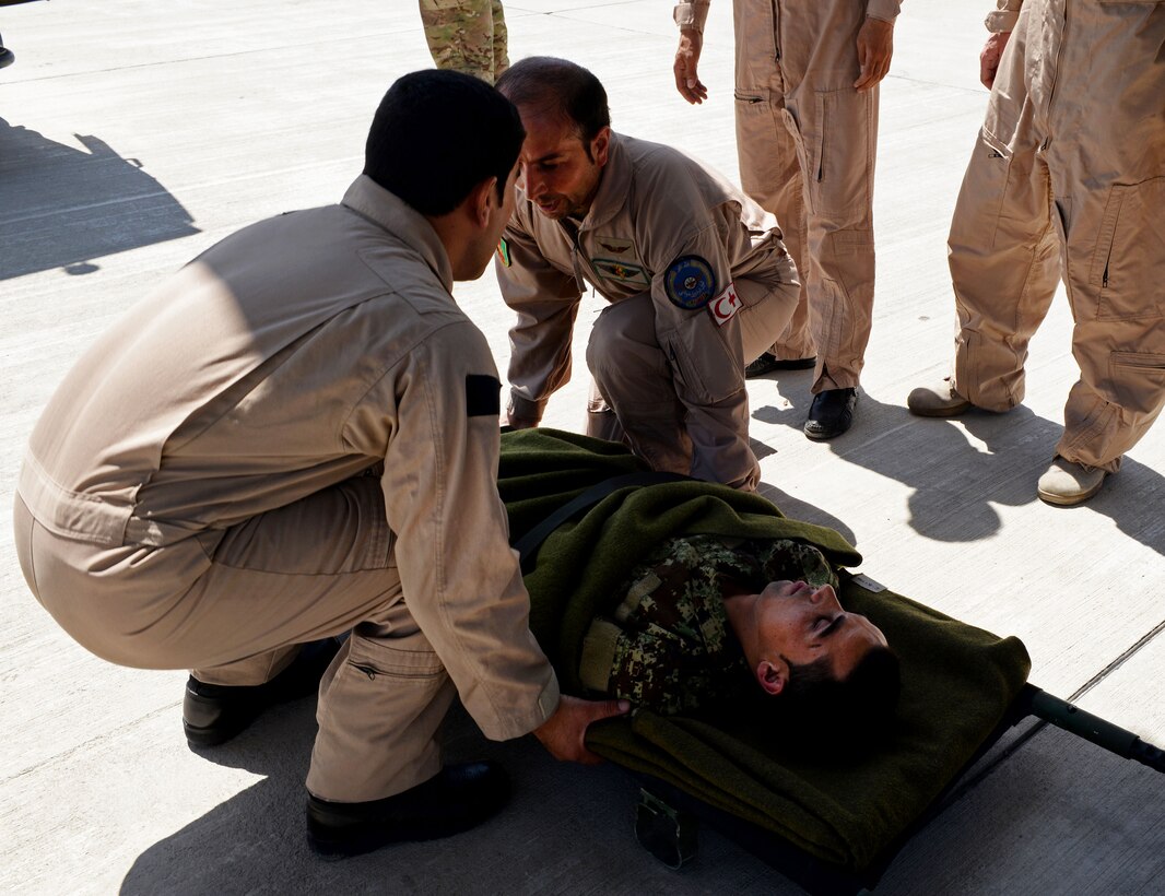 U.S. troops observe members of the Afghan National army medical ...