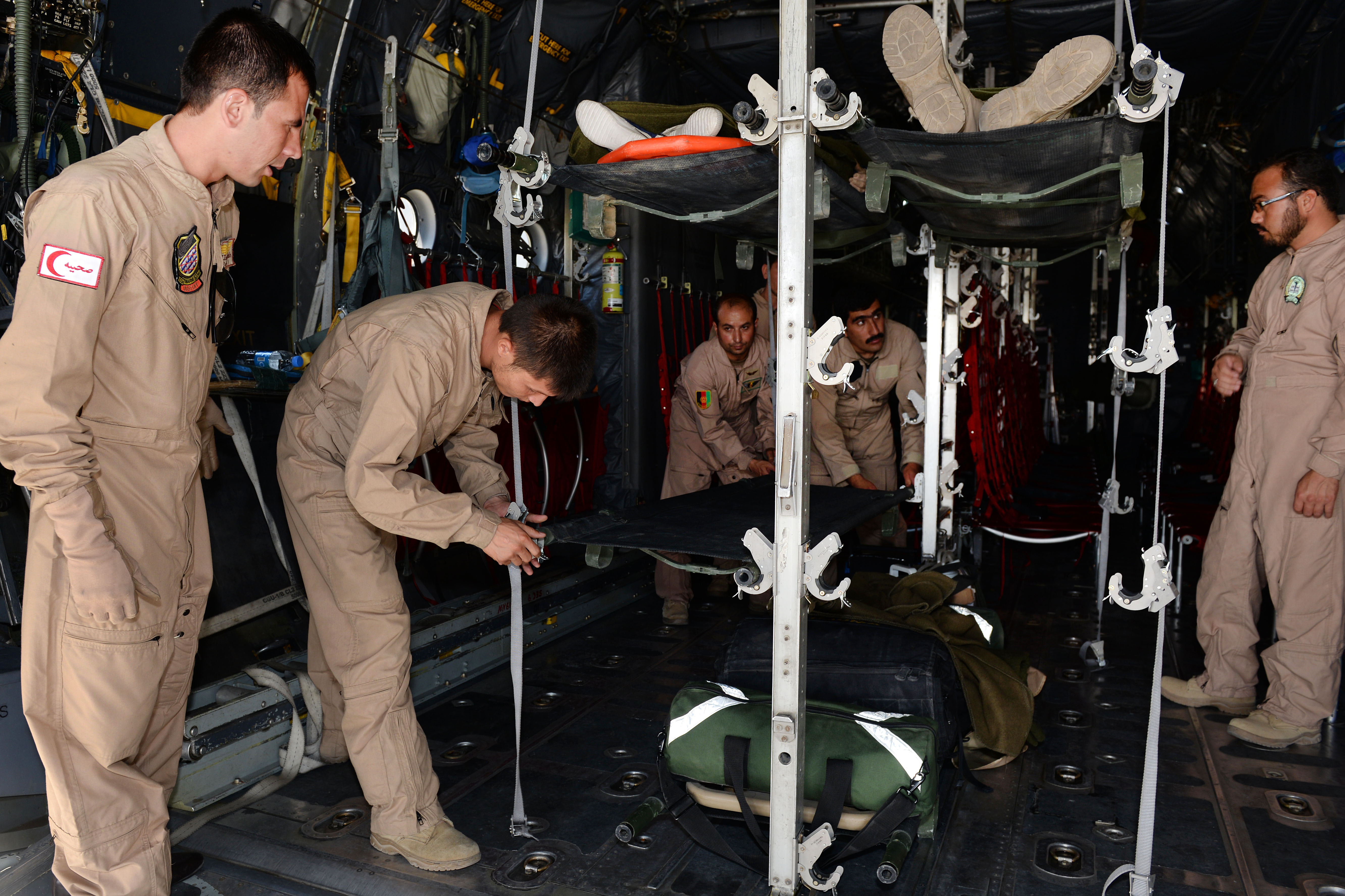 U.S. troops observe members of the Afghan National army medical ...