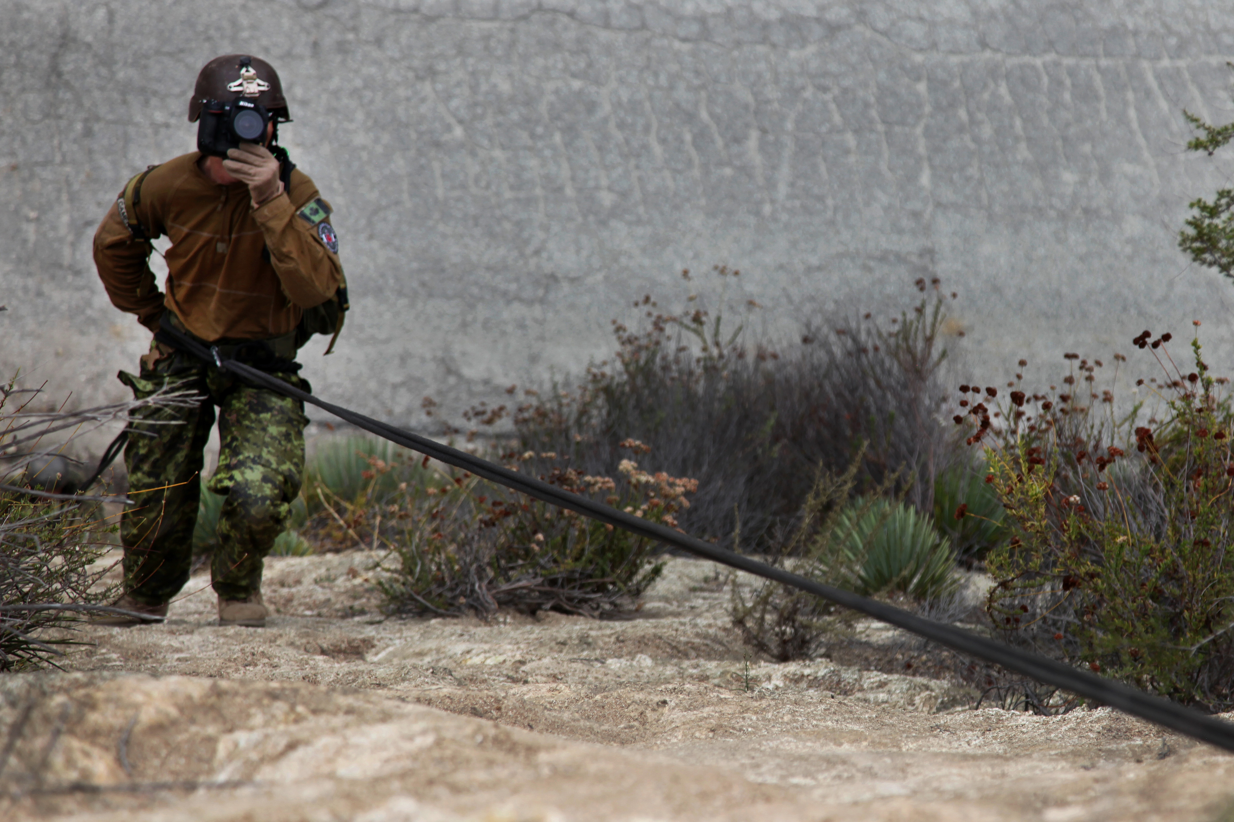 Canadian armed forces Master Cpl. Kevin McMillan takes a photo while ...