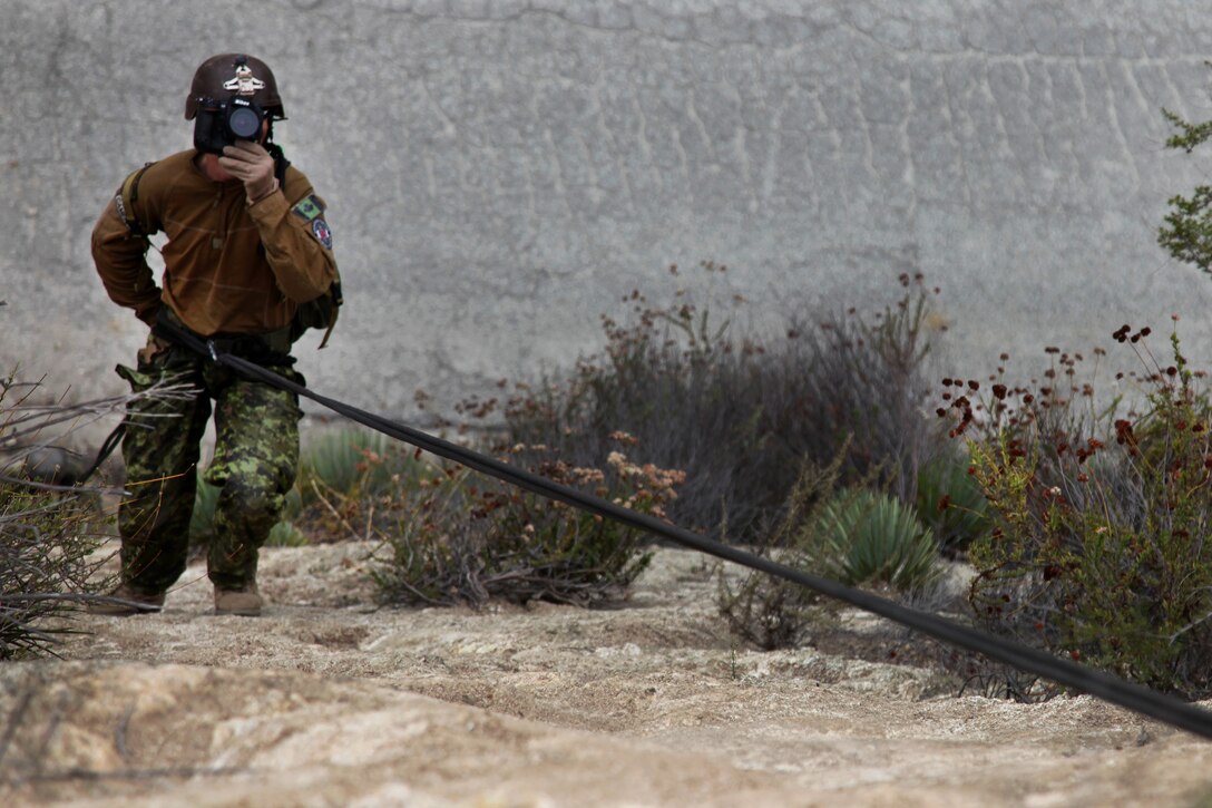 Canadian armed forces Master Cpl. Kevin McMillan takes a photo while ...