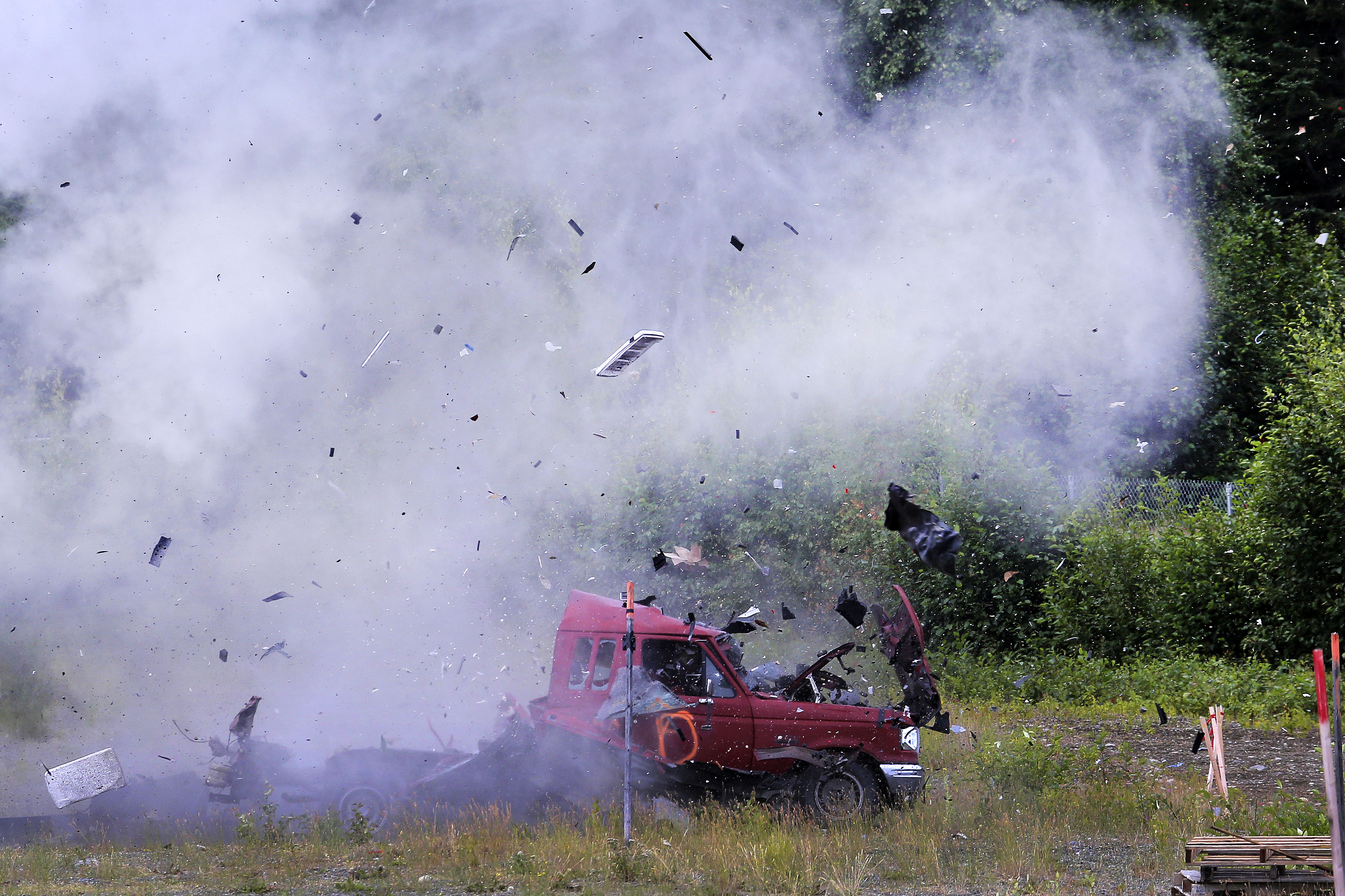 An explosive device is control-detonated to demonstrate the blast ...