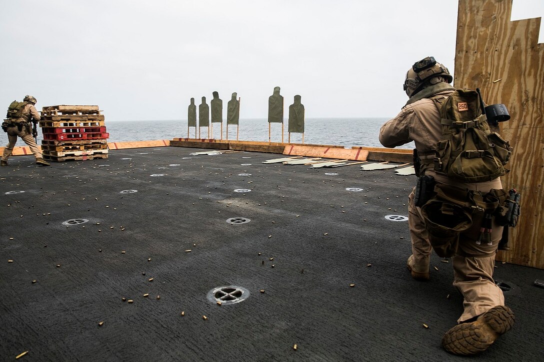 U.S. Marines practice barricade shooting at sea