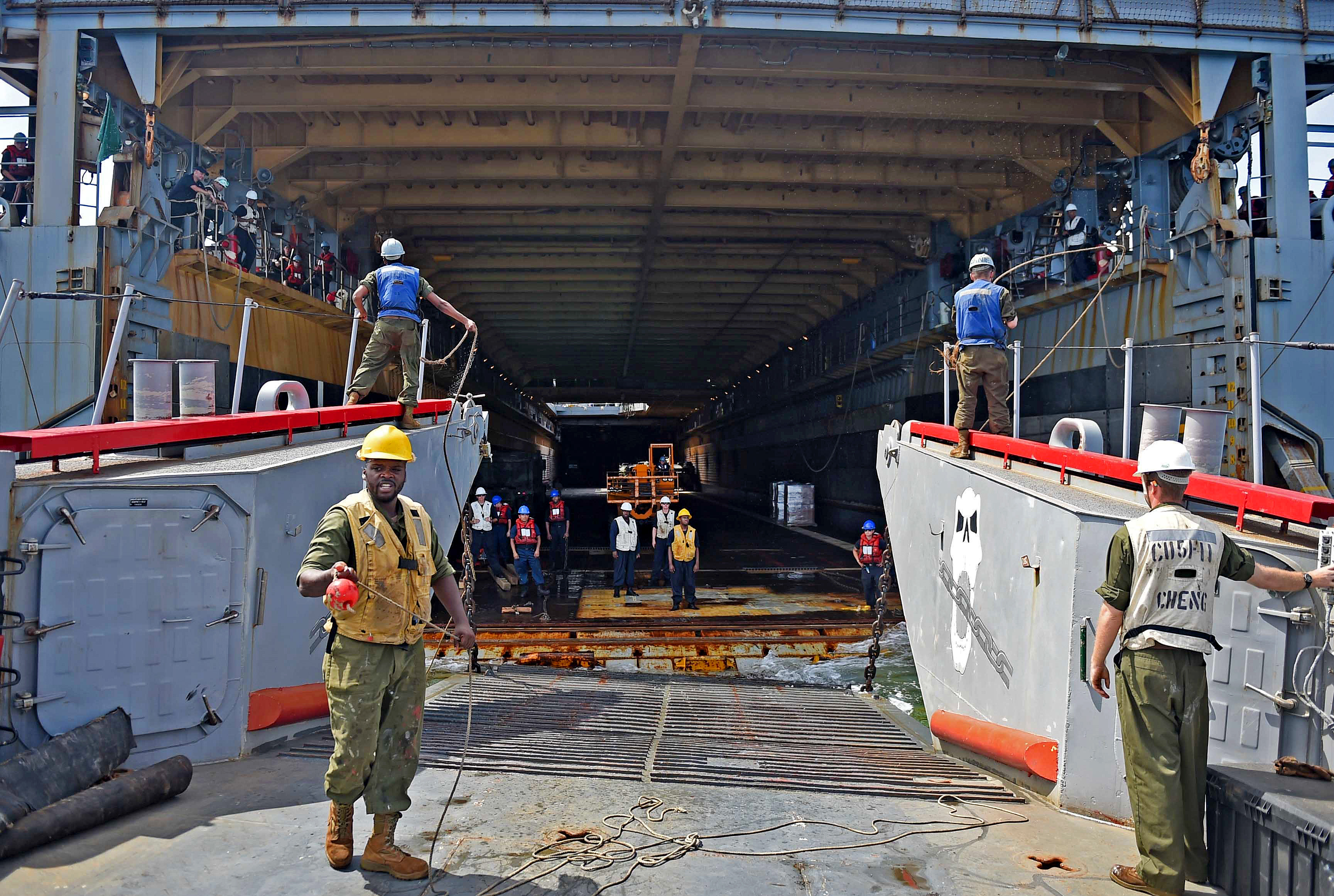 U.S. sailors on Landing Craft Utility 7 attached to Naval Beach Unit 7 ...