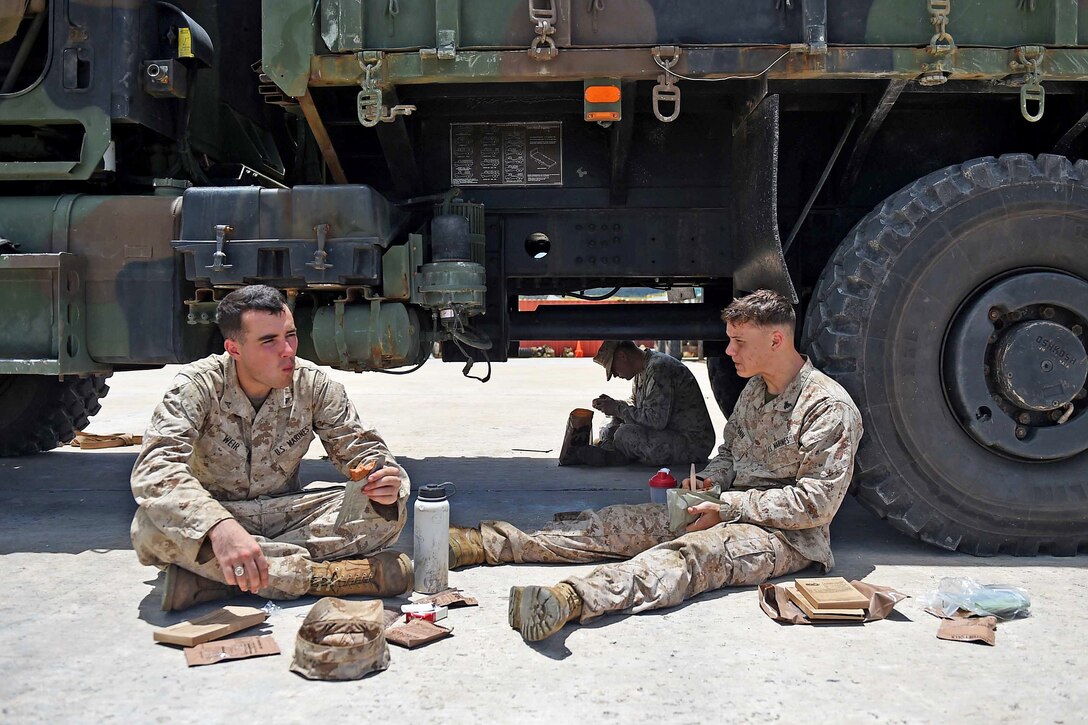 U.S. Marines eat Meals Ready to Eat while working on disaster relief ...