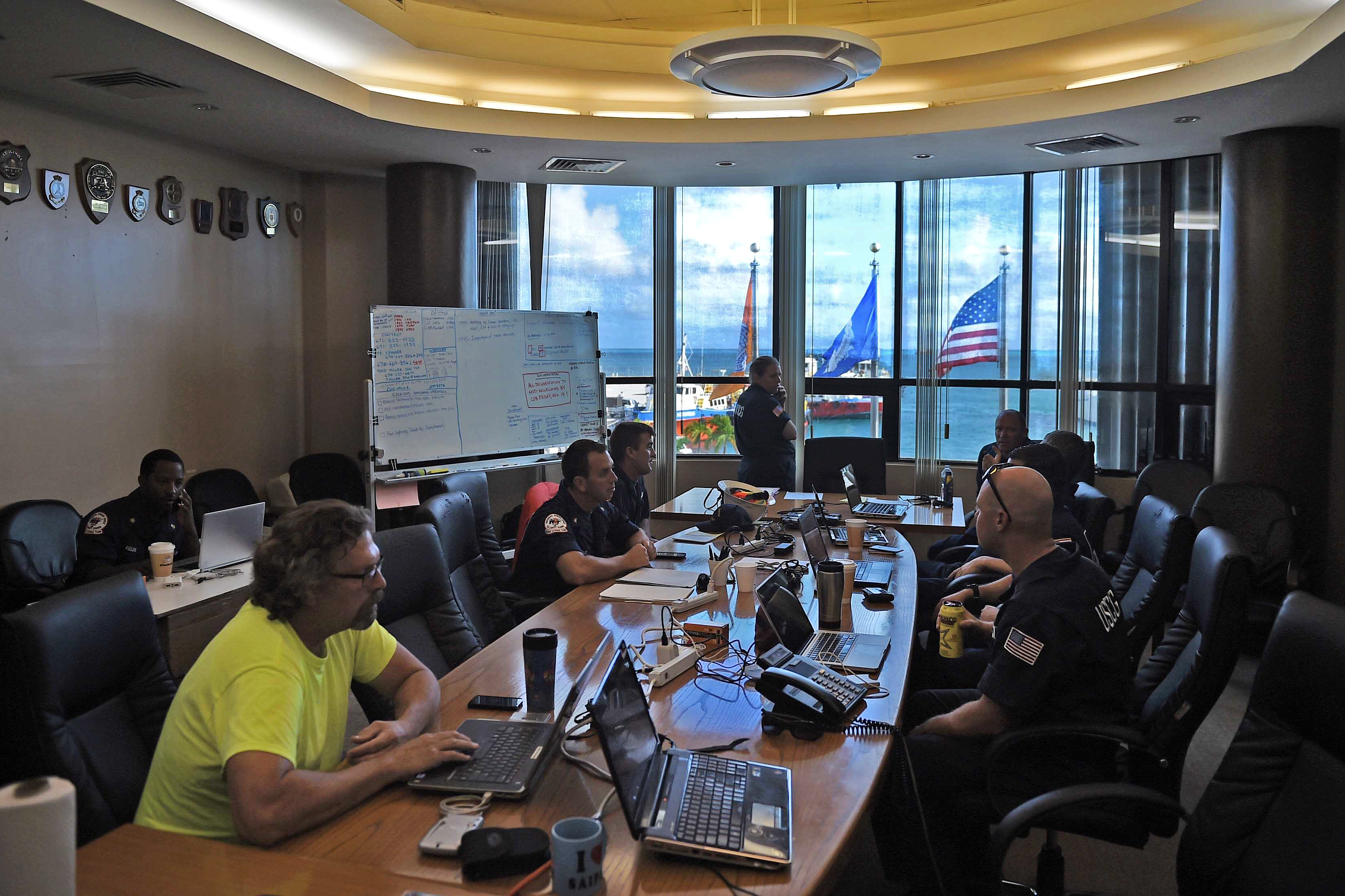 Members from the U.S. Coast Guard’s Pacific Strike Team, the Marine ...