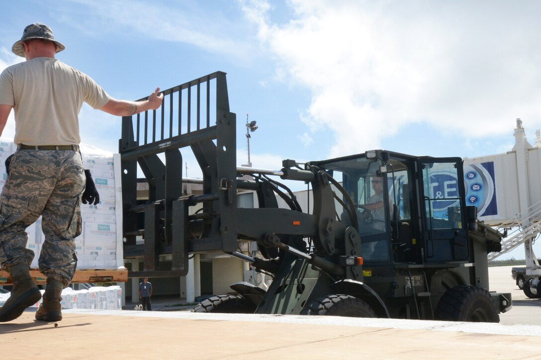 U.S Air Force Master Sgt. Michael Sibley, left, directs U.S Air Force ...