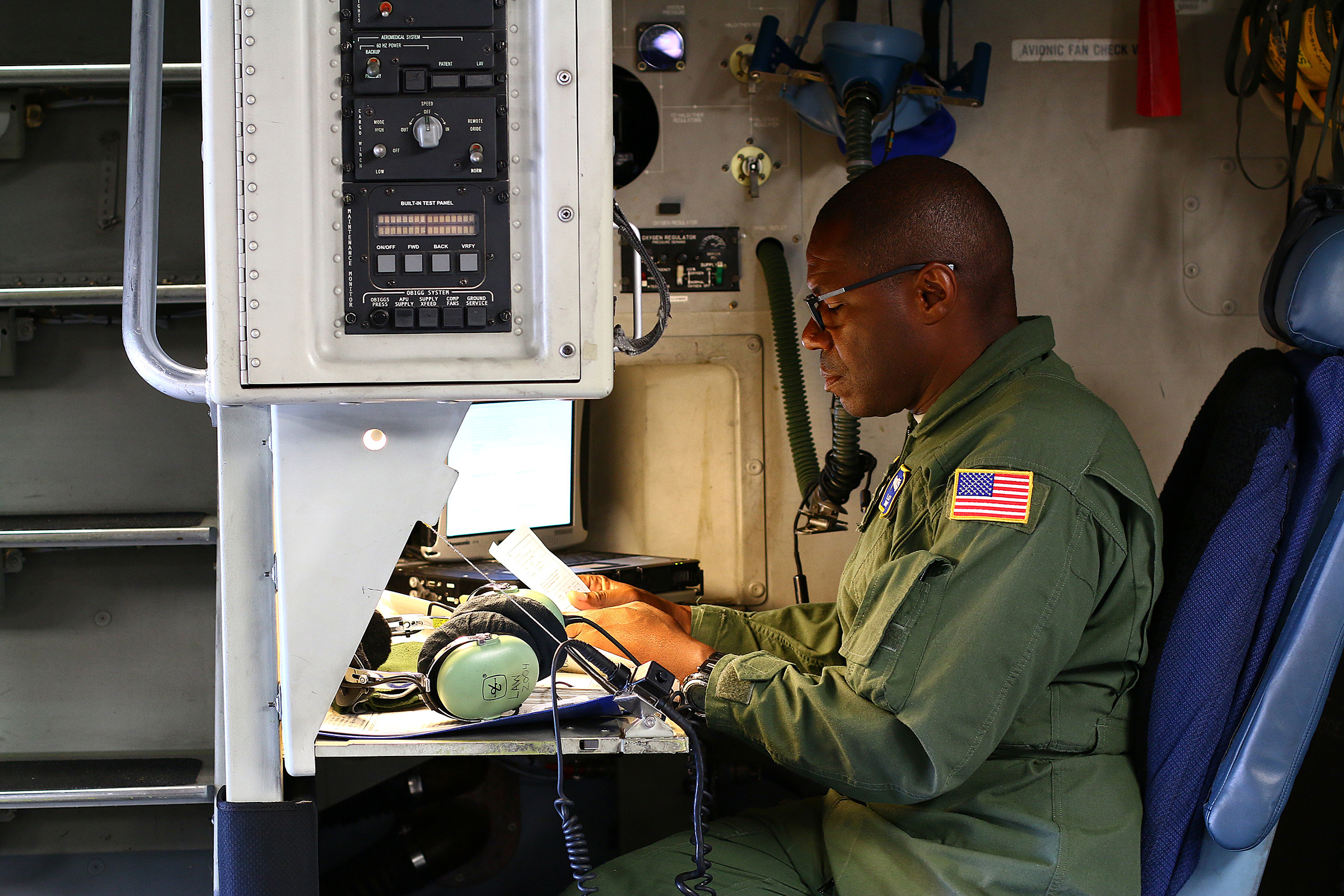 89 AS loadmaster prepares for mission