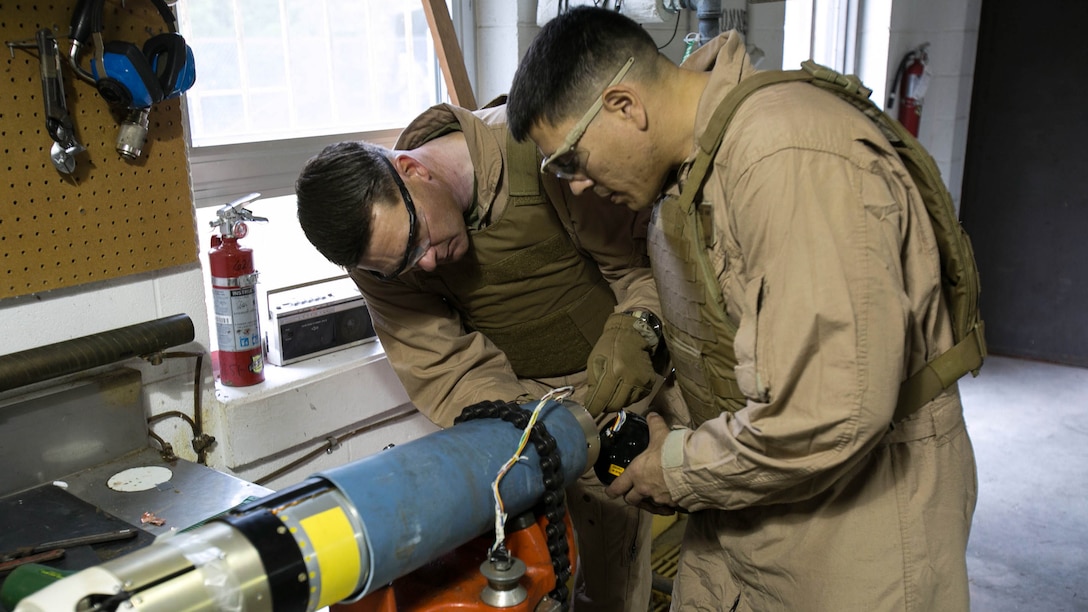 Steady hands: EOD technicians disarm Griffin missile
