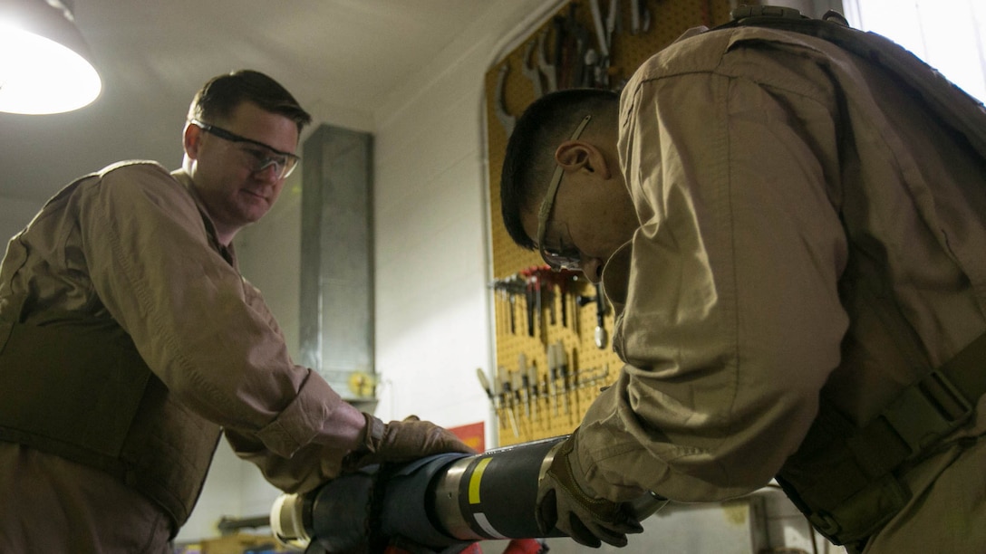 Steady hands: EOD technicians disarm Griffin missile