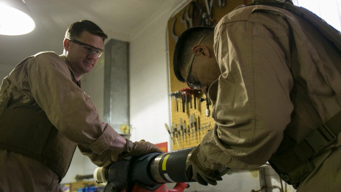 Steady hands: EOD technicians disarm Griffin missile