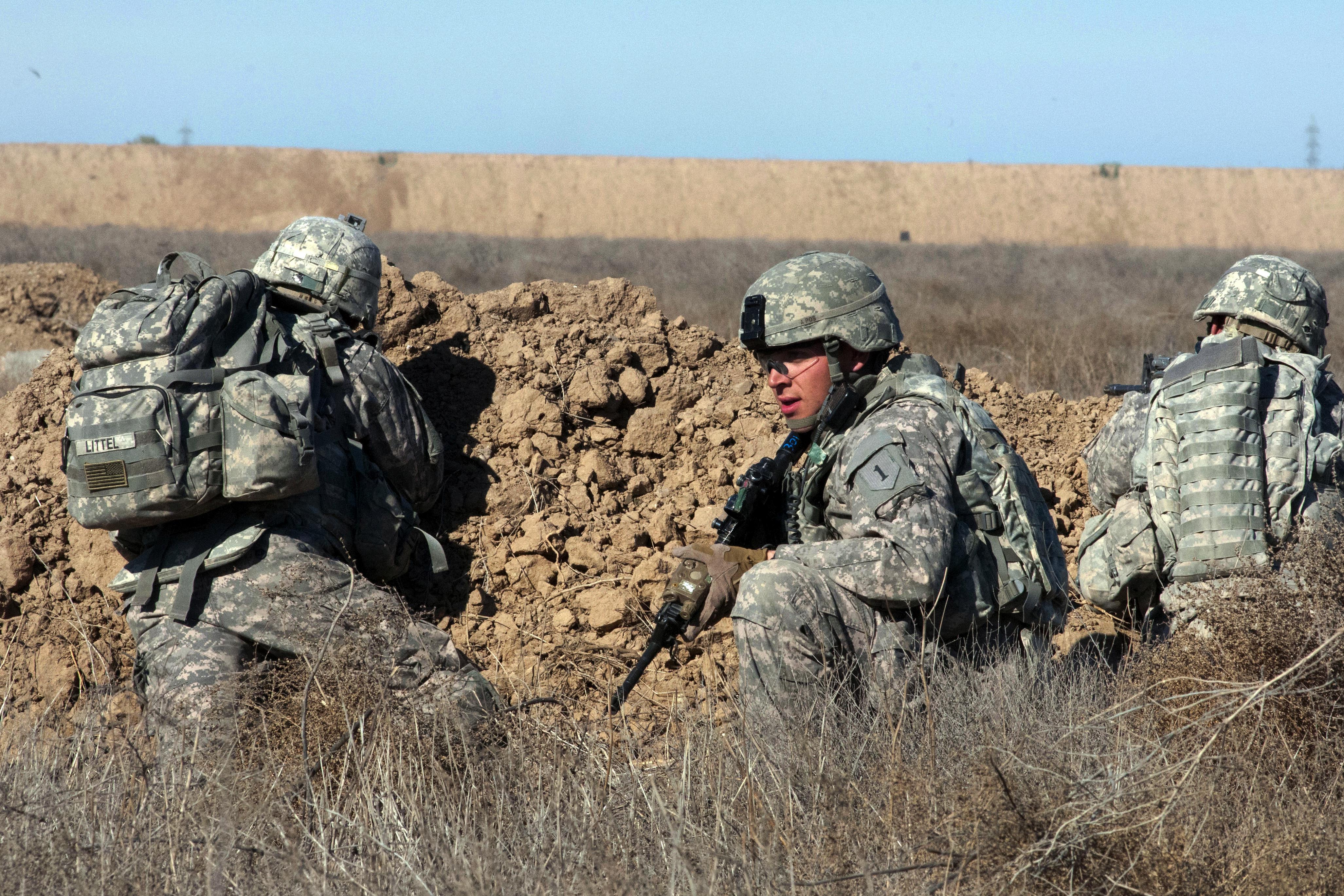 U.S. soldiers conduct a platoon live-fire demonstration for Iraqi army ...
