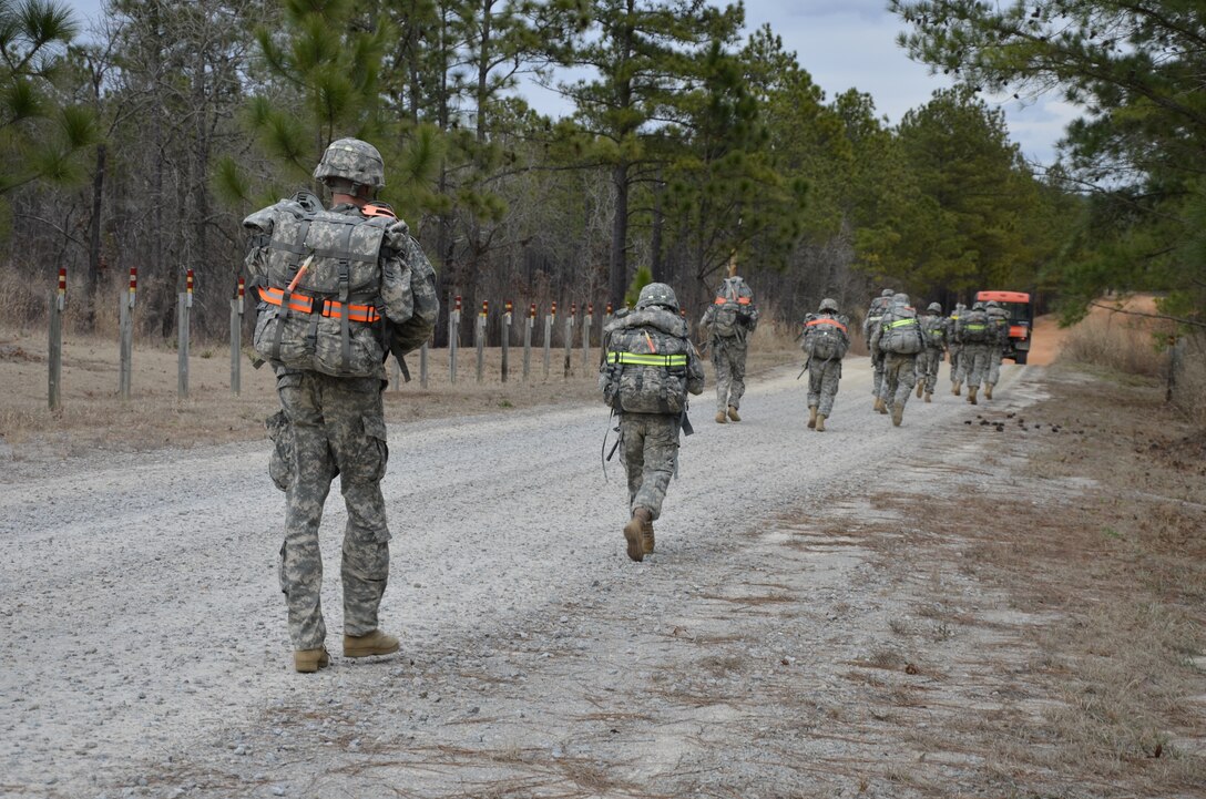 Soldiers participate in a ruck march as part of the South Carolina Army ...