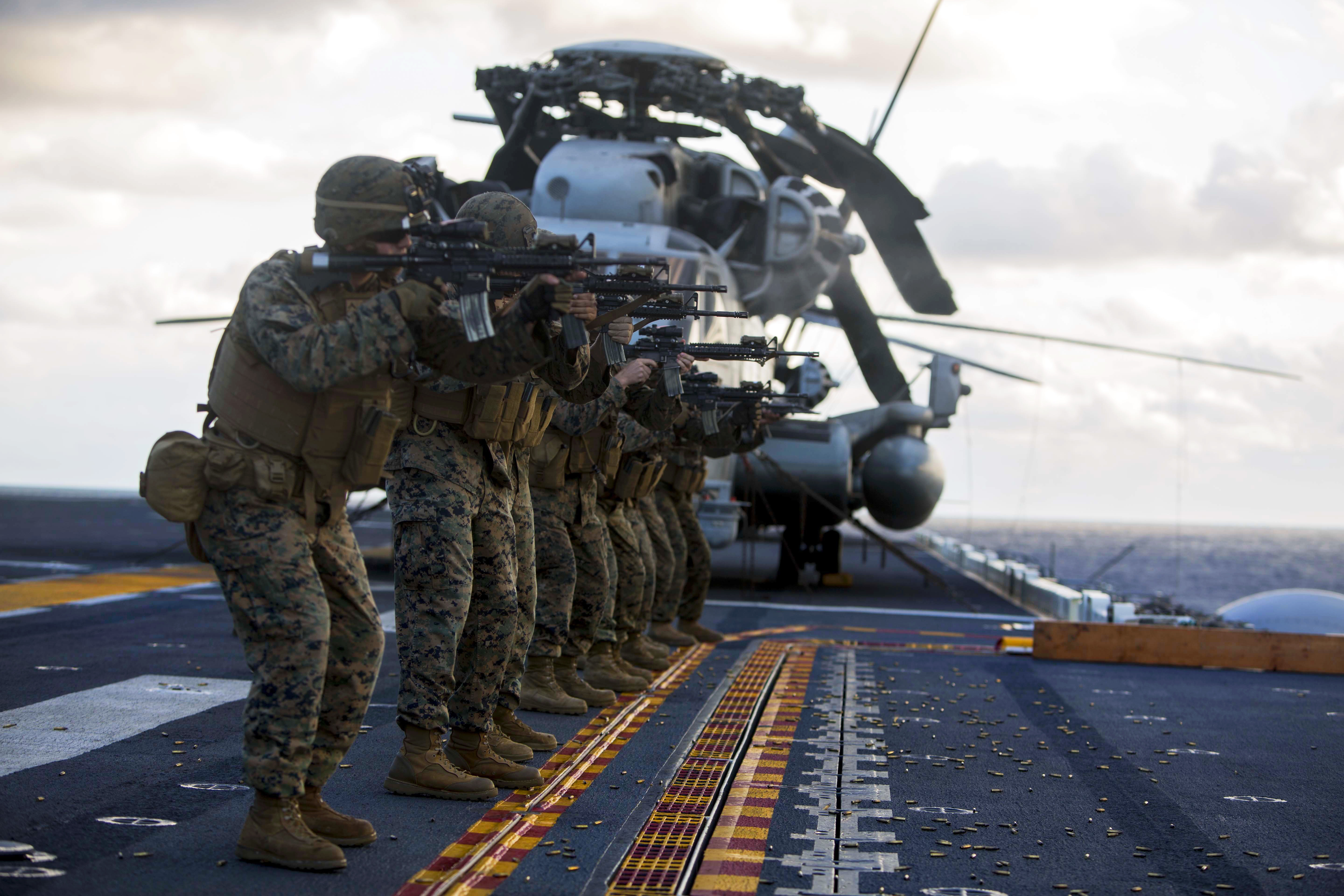U.S. Marines stand on line as they conduct a live-fire exercise on the ...