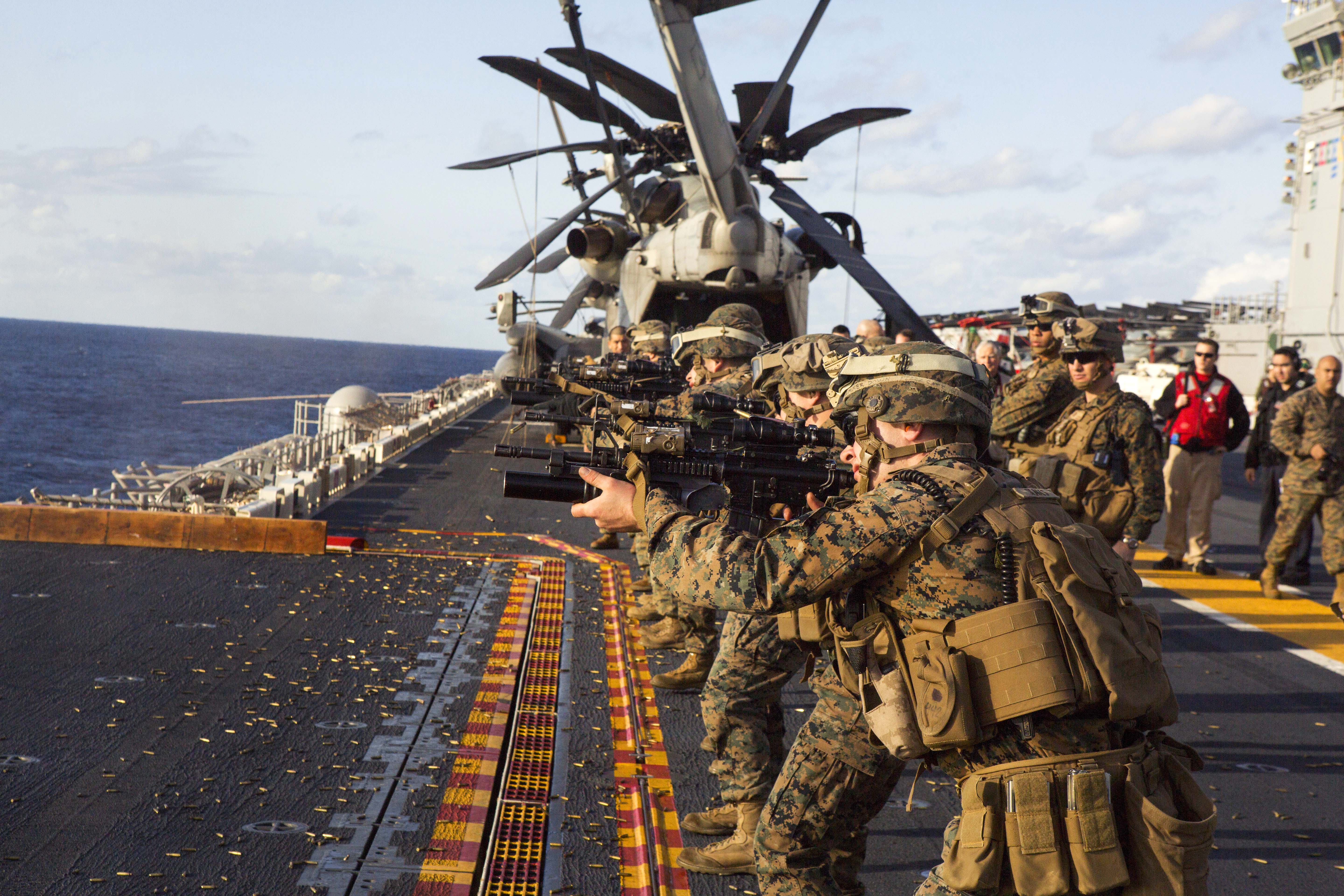 U.S. Marines fire their weapons during a live-fire exercise on the ...