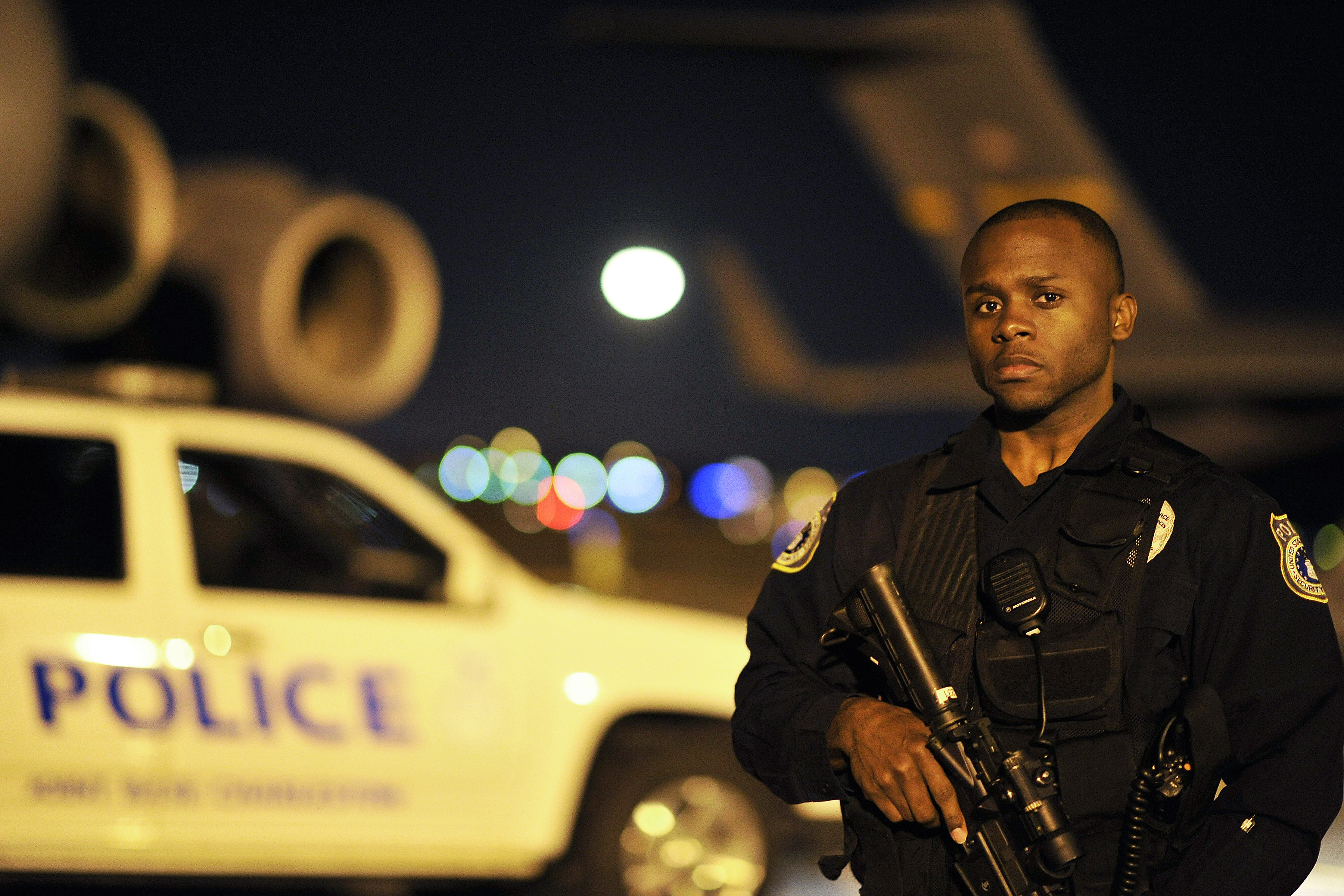 Marvin Walker, a police officer, secures the flightline on Joint Base ...