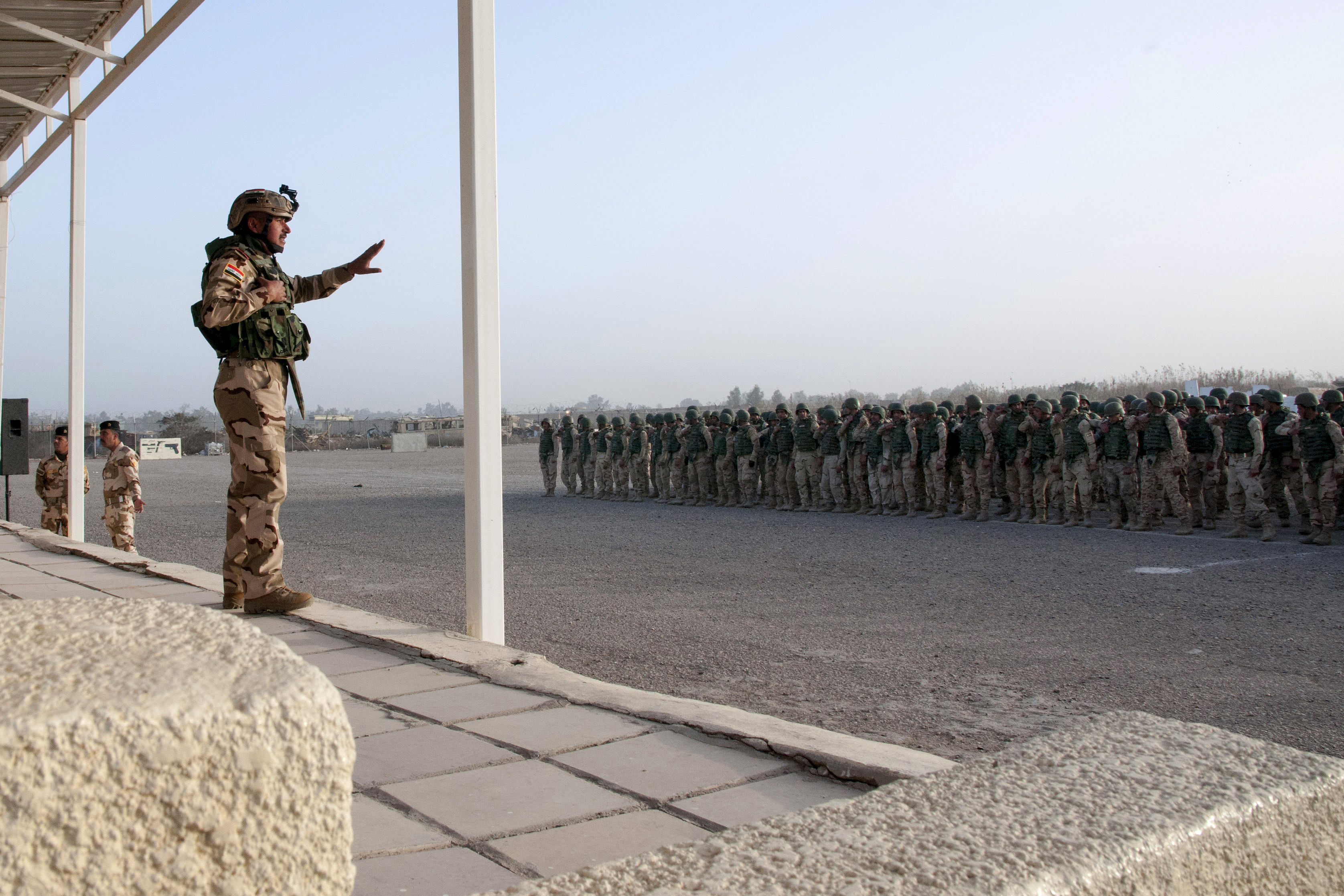 Iraqi army Lt. Col. Mohammad, left, a battalion commander with the 72nd ...