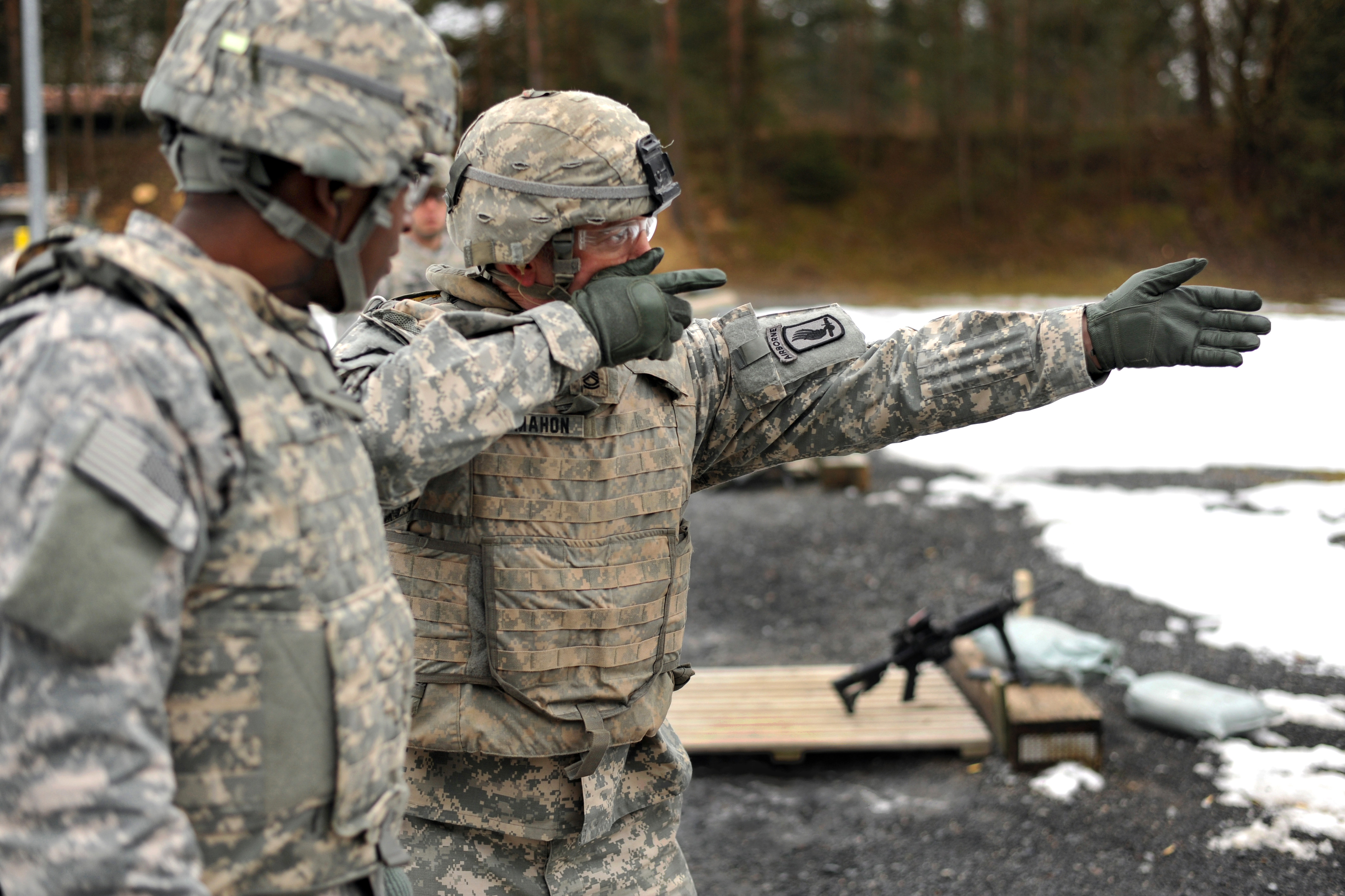 U.S. Army Sgt. 1st Class David McMahon, right, demonstrates the proper ...