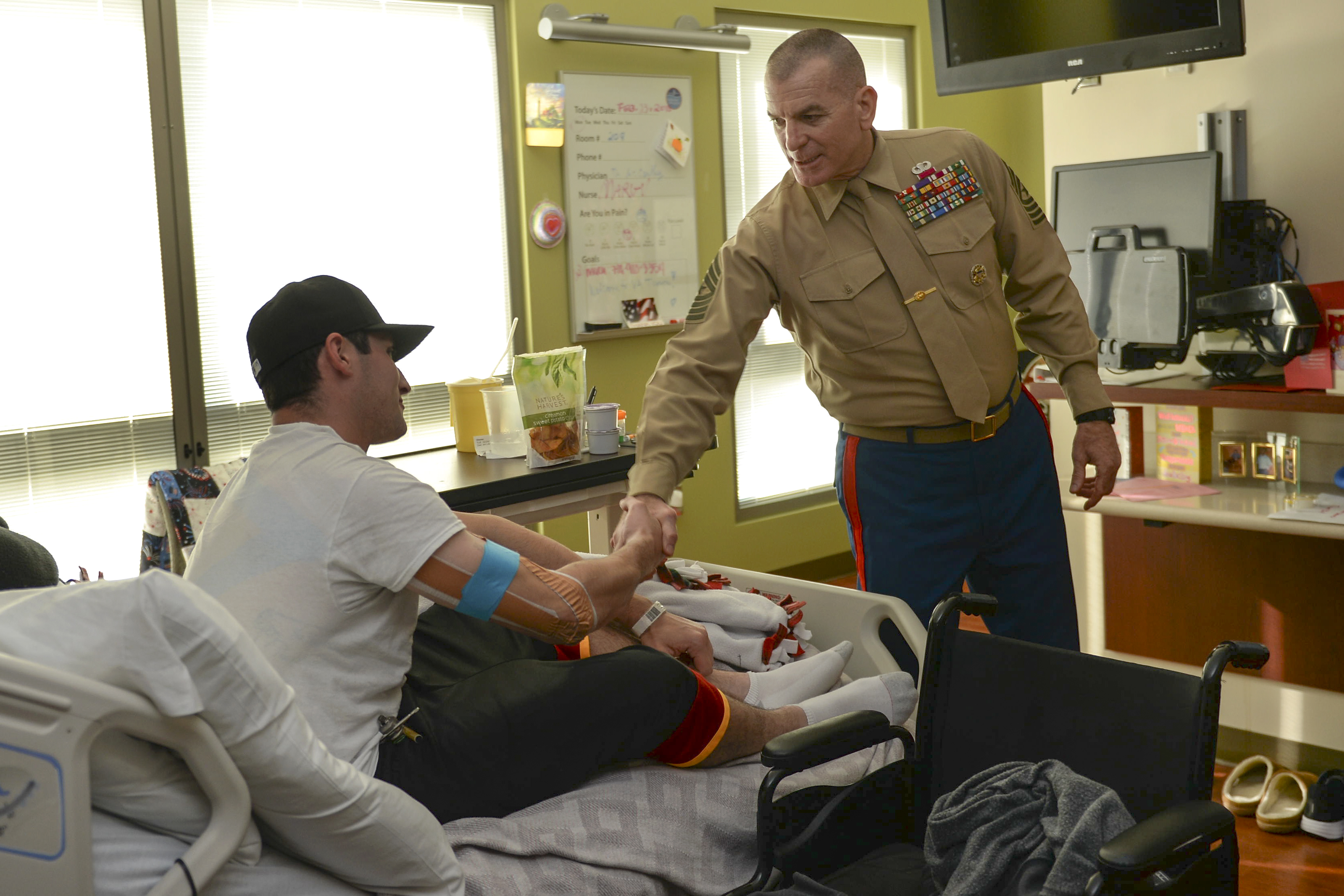 Marine Corps Sgt. Maj. Bryan Battaglia, right, senior enlisted advisor ...