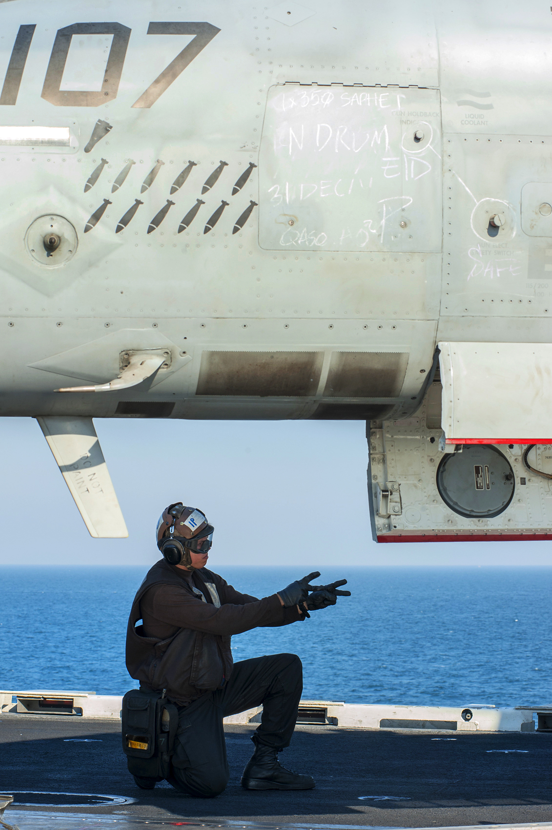 U.S. Navy Seaman Clinton Gibson starts the engines for an F/A-18F Super ...
