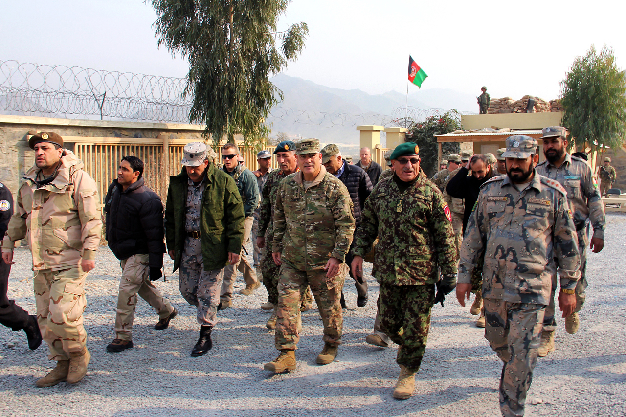 U.S. Army Gen. John Campbell, center, commander Resolute Support, walks ...