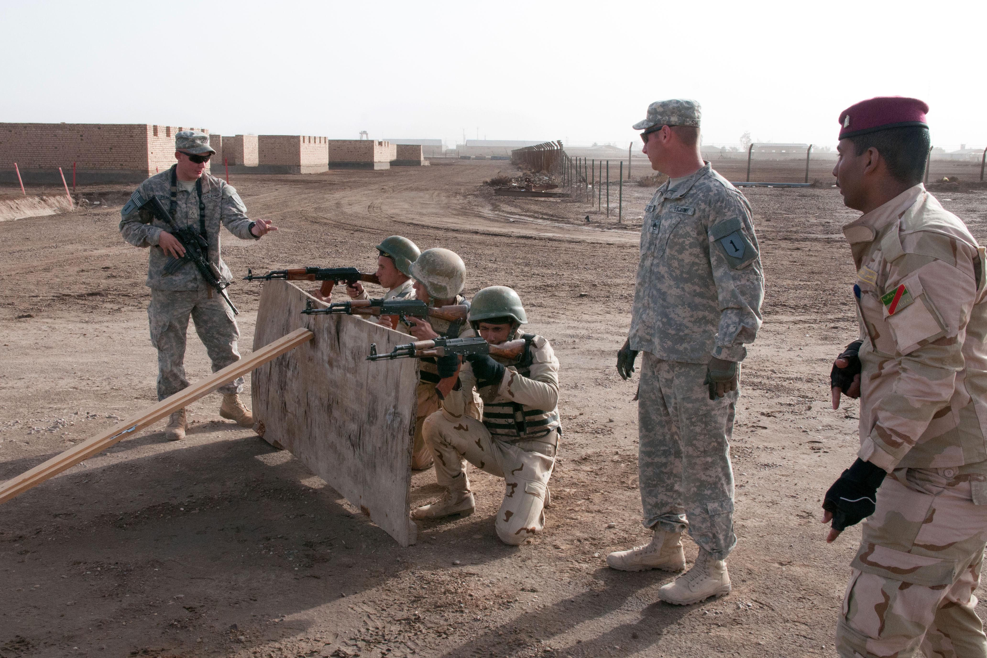 U.S. Army Staff Sgt. Jacob Sweet, second from right, observes as U.S ...