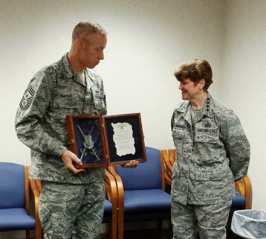 Gen. Janet Wolfenbarger, AFMC commander, receives the formal invitation ...