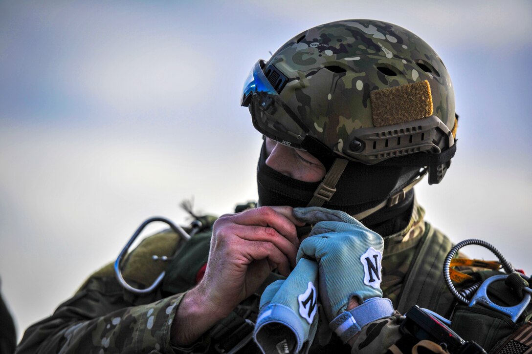 An ariman prepares for a high-altitude, low-opening jump from an MC ...