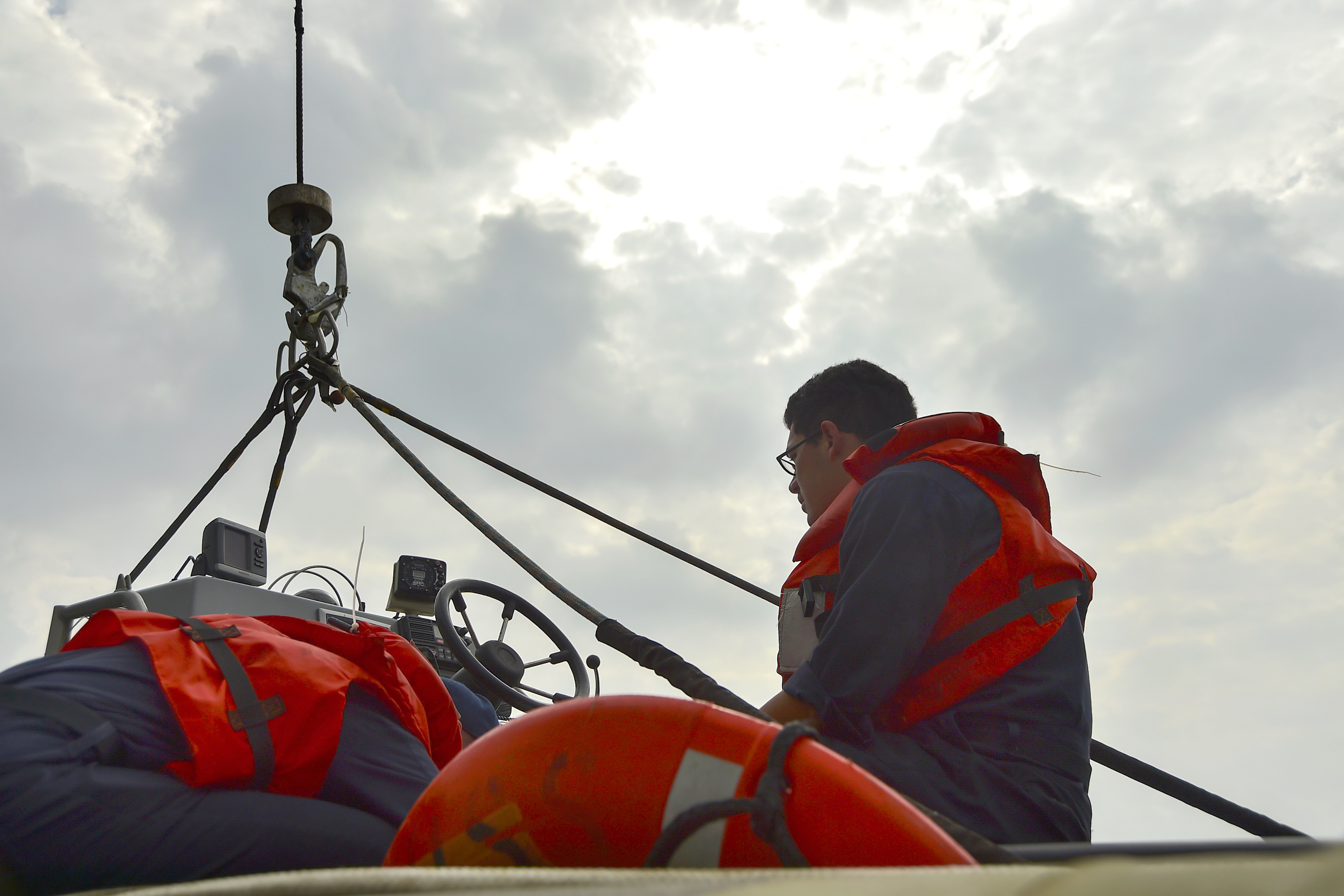 U.S. Navy Seamen Michael Stephenson, right, and Warren Potts perform ...